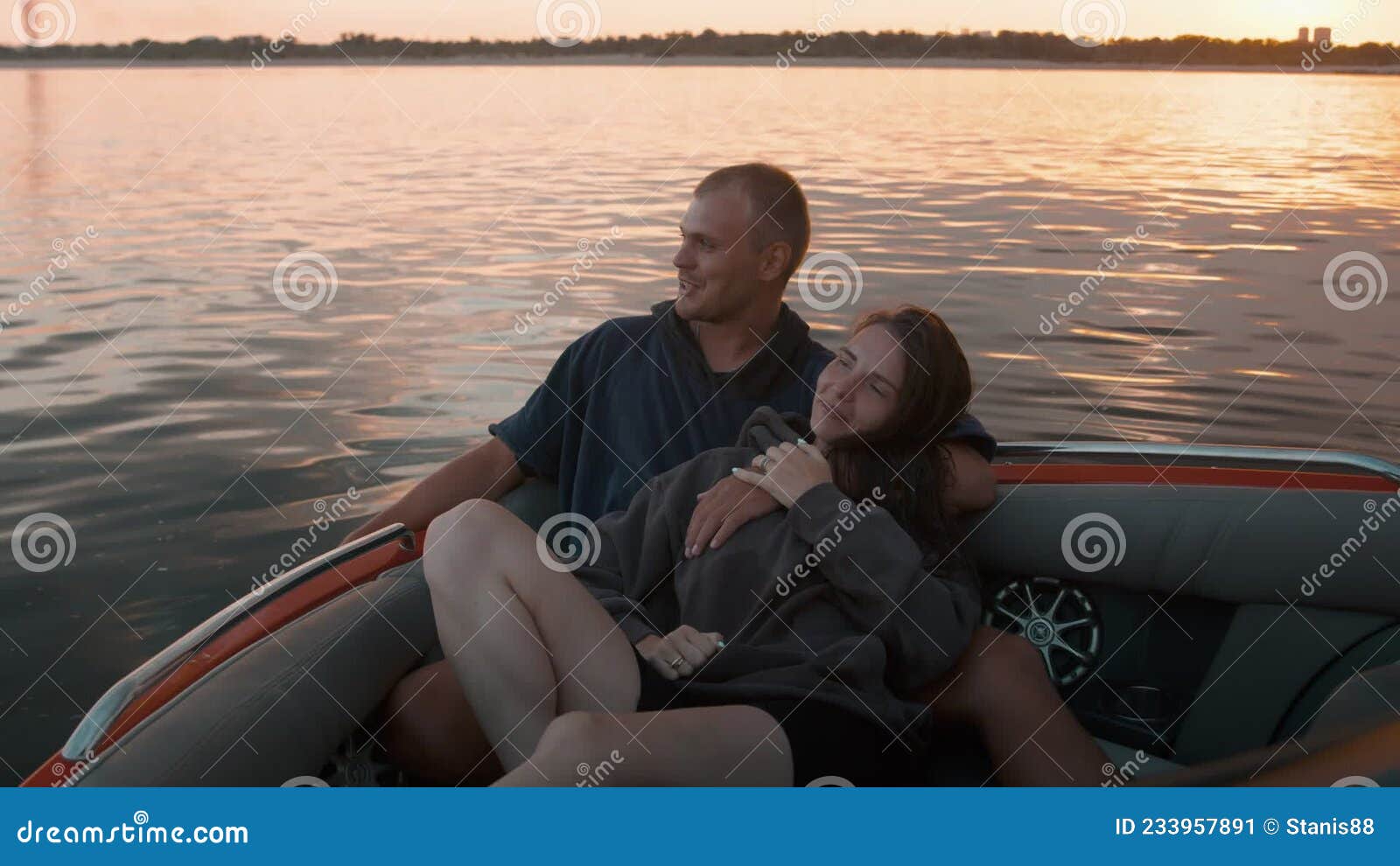 A Guy and a Girl Cuddle Cute at Sunset Sitting in a Boat Stock Video ...