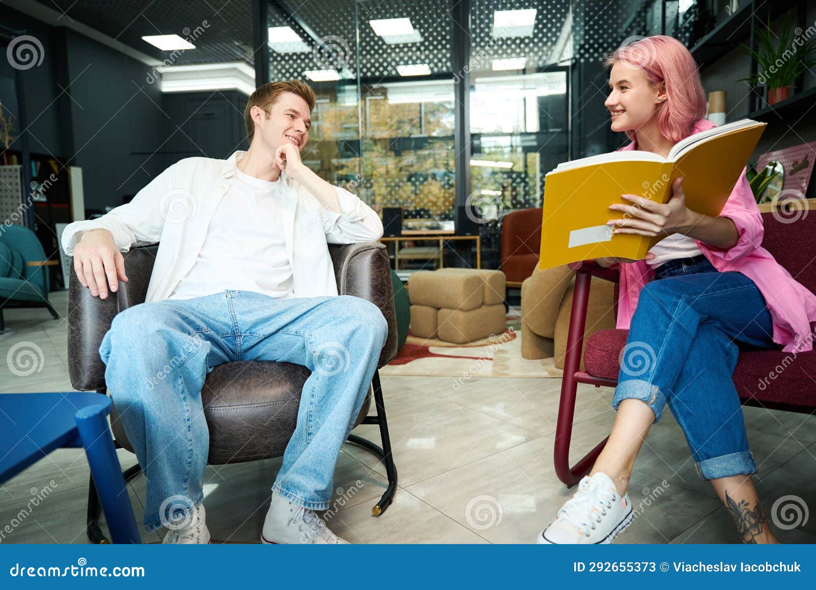 Guy with Girlfriend is Sitting in Soft Chairs in Design Studio Stock ...