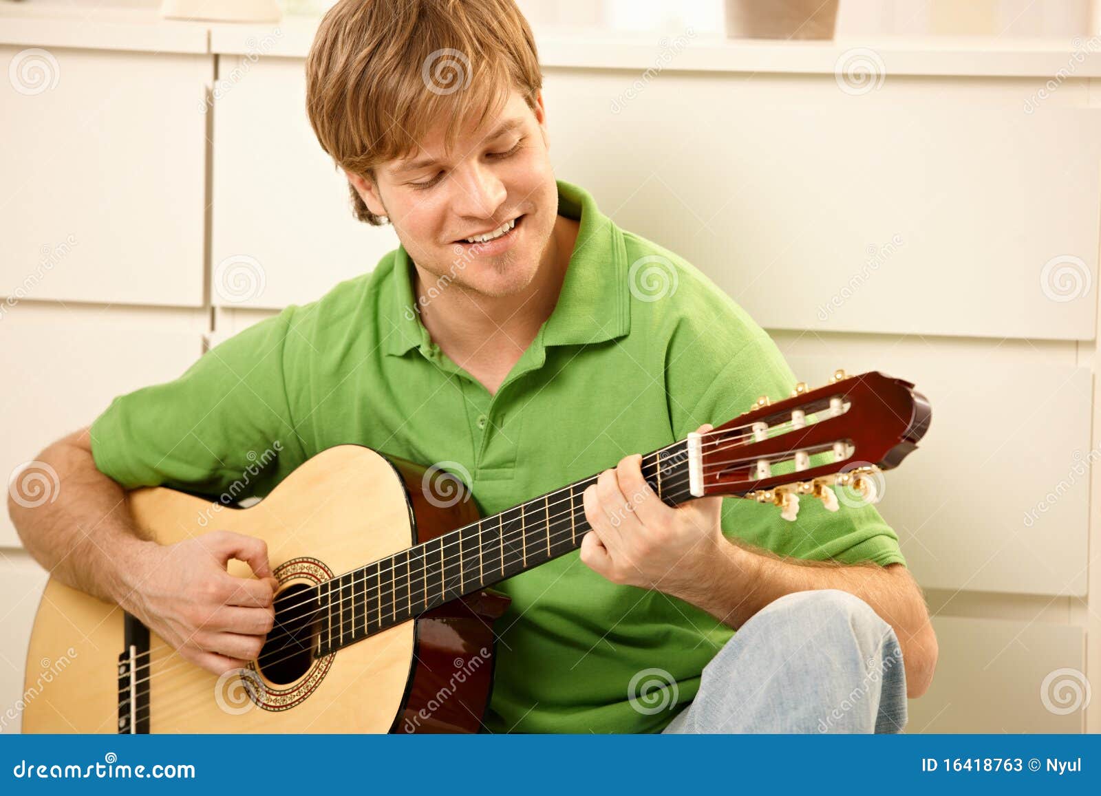 Guy with guitar stock image. Image of colors, face, jeans - 16418763