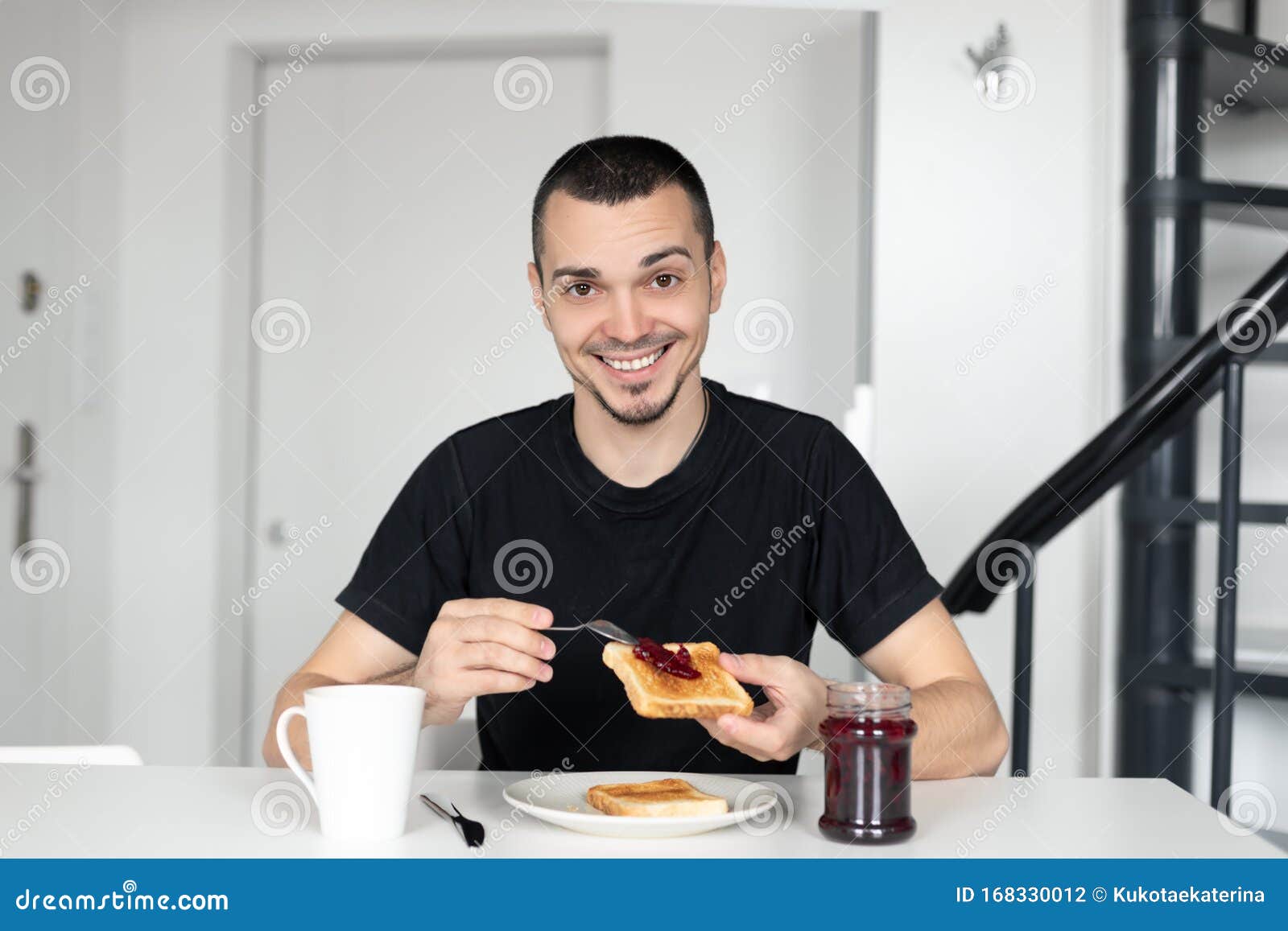 The Guy Has Breakfast with Toast with Jam Stock Photo - Image of bread ...