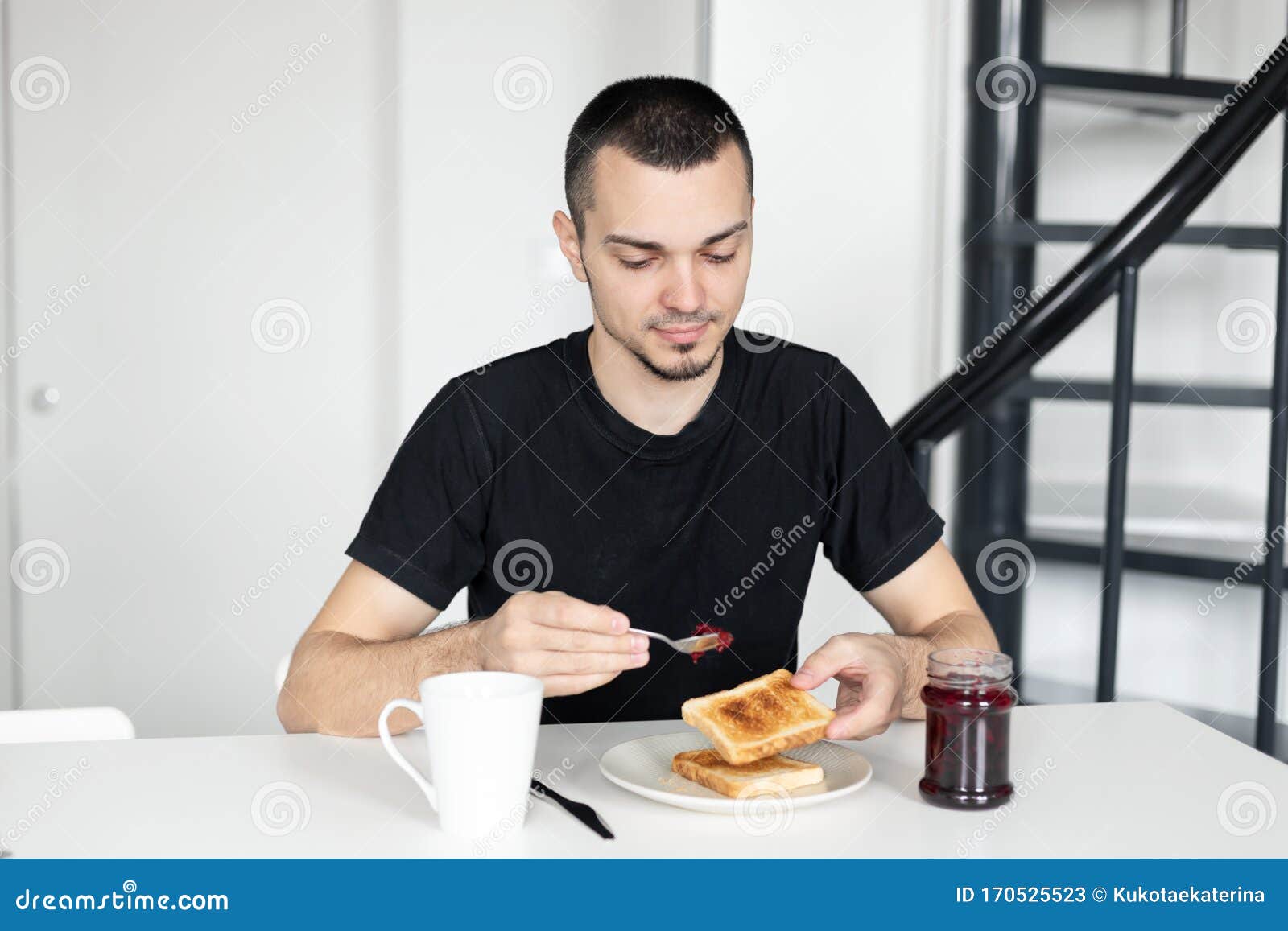 The Guy Has Breakfast with Toast with Jam Stock Image - Image of light ...