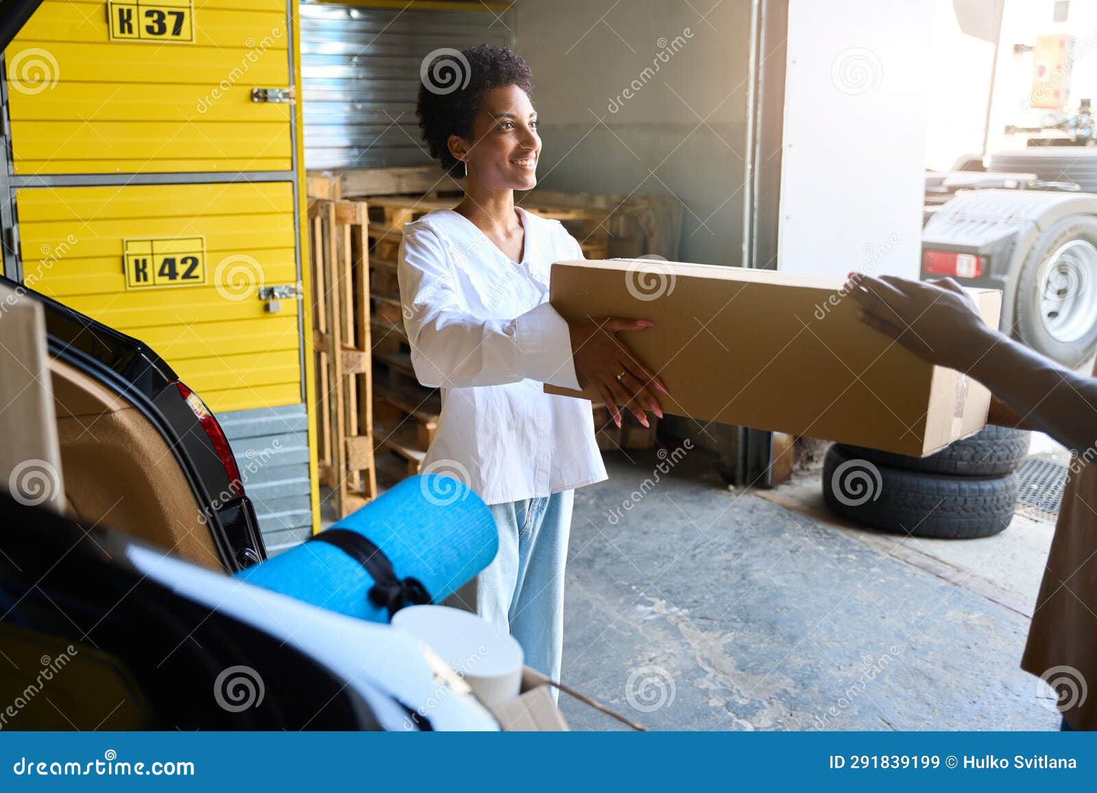 Guy and His Girlfriend are Unloading the Trunk of a Car Stock Image ...
