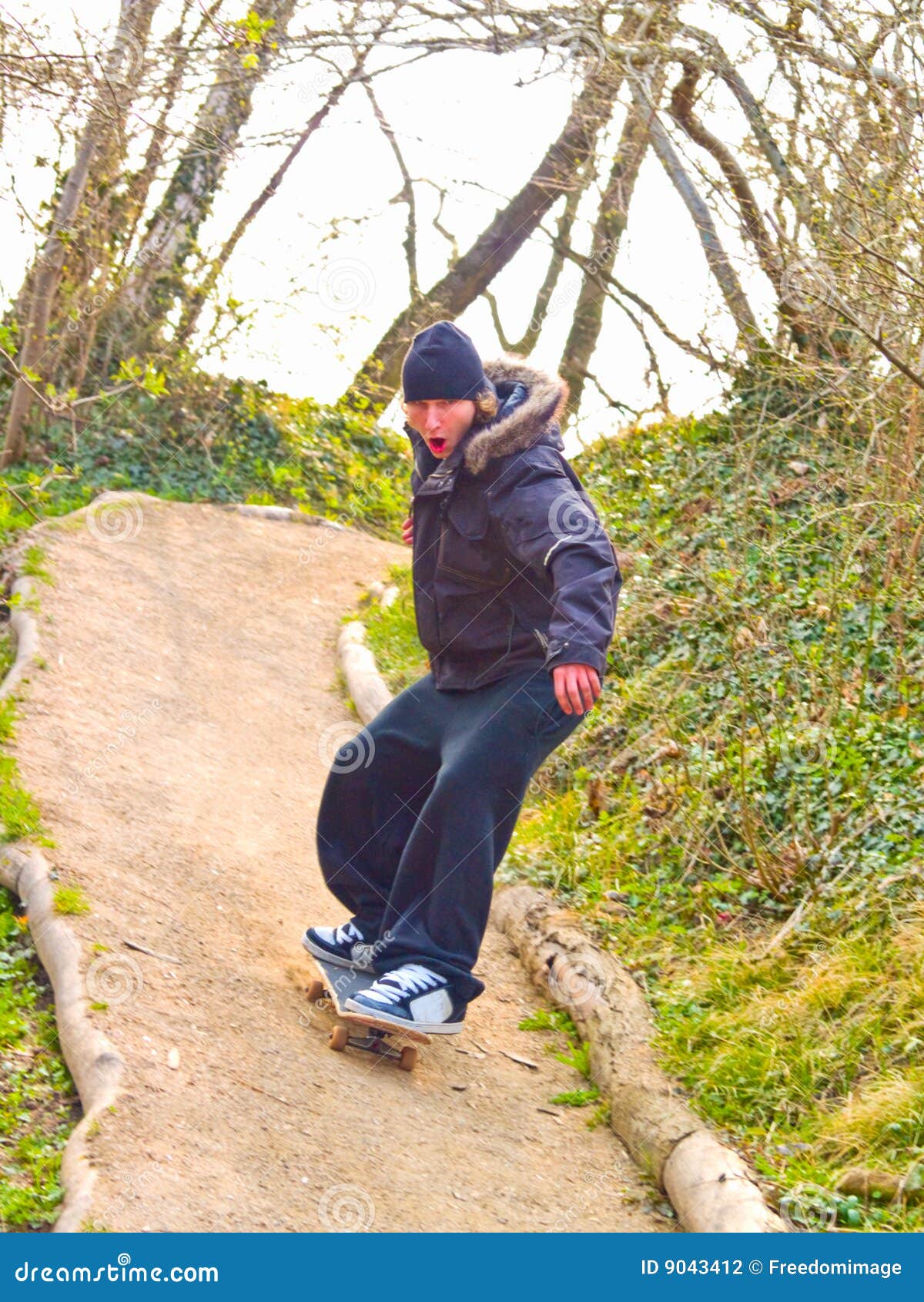 Guy on His Skateboard Flying Down a Path Stock Photo - Image of casual ...
