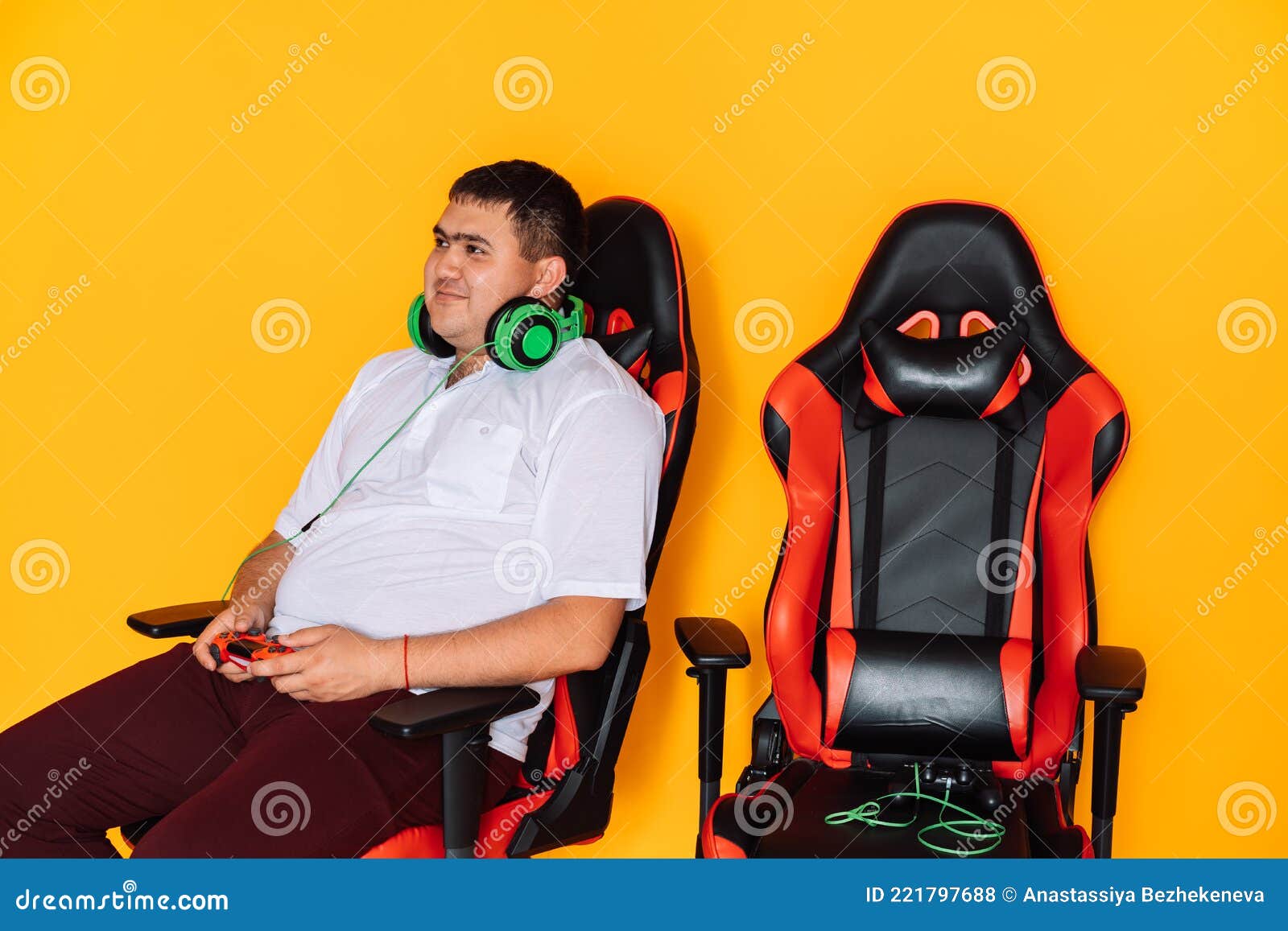 Guy Holding Game Controller Playing Video Games while Sitting on Gaming ...