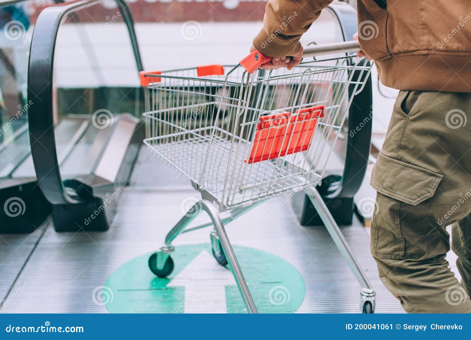 The Guy Is Holding A Supermarket Trolley Stock Photo | CartoonDealer ...