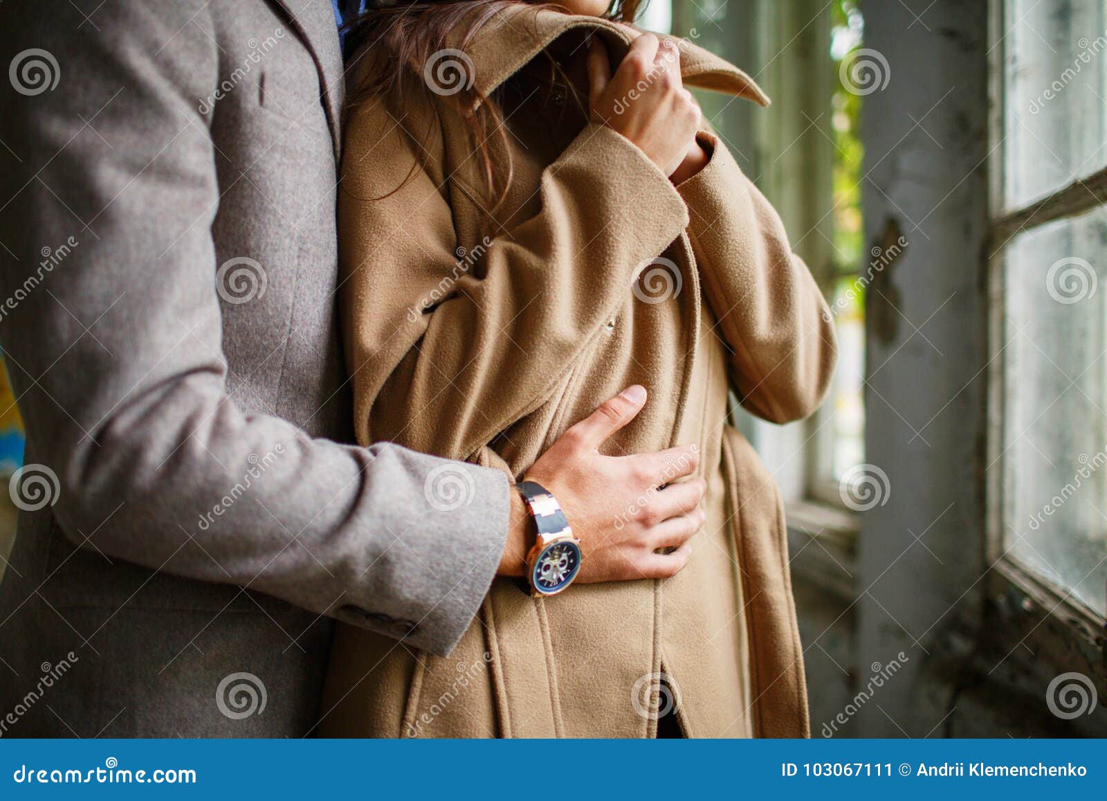 The Guy Hugs The Girl From Behind Inside Indoors Stock Image Image