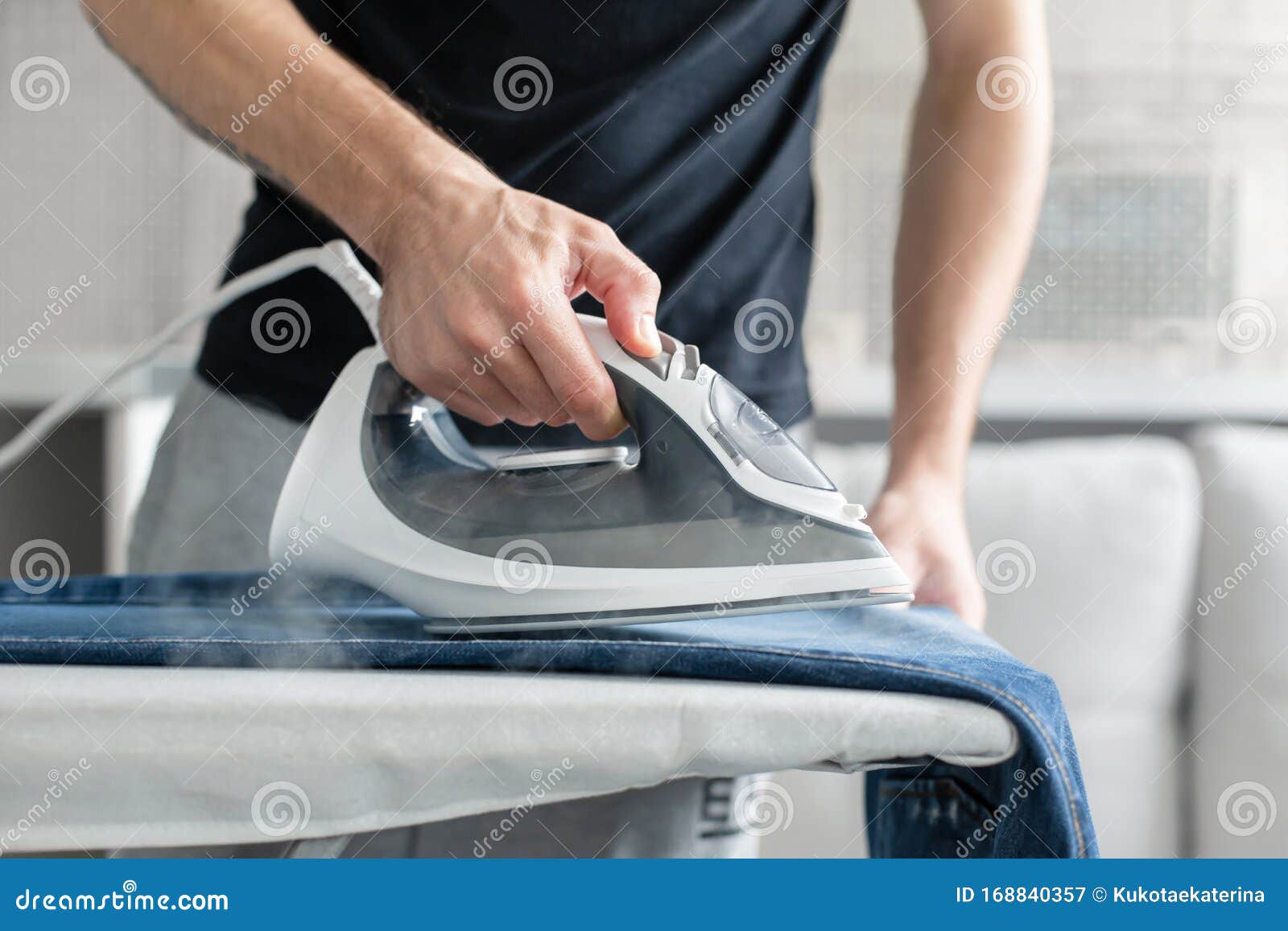 A Guy Ironing Clothes before Going Outside Stock Image - Image of iron ...