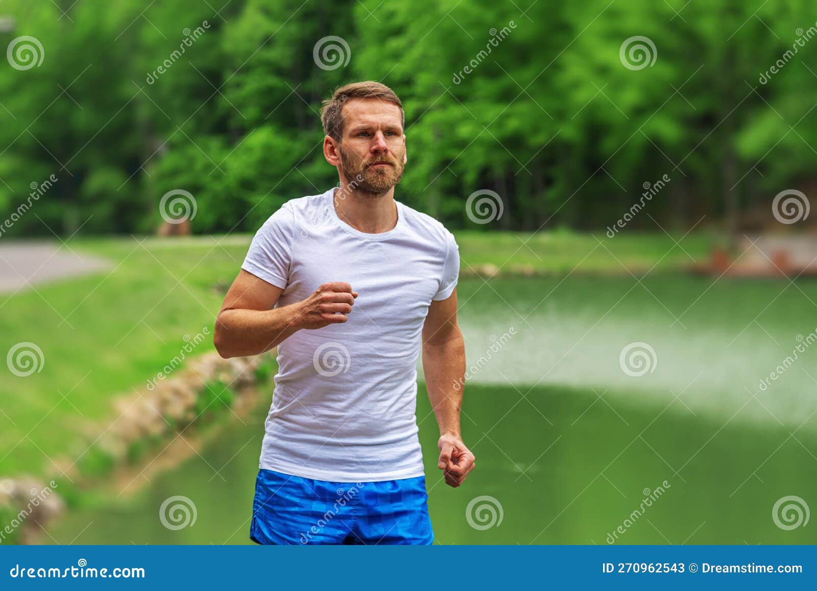 Guy jogging outdoors. stock image. Image of training - 270962543