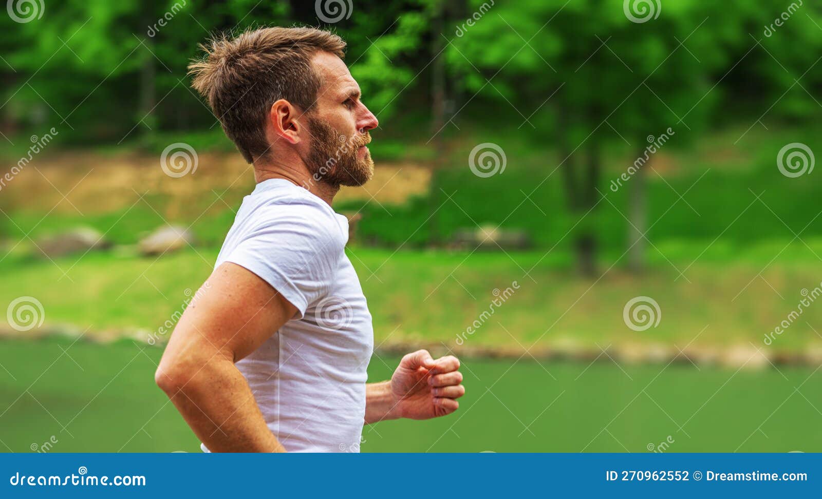 Guy jogging outdoors. stock photo. Image of exercise - 270962552