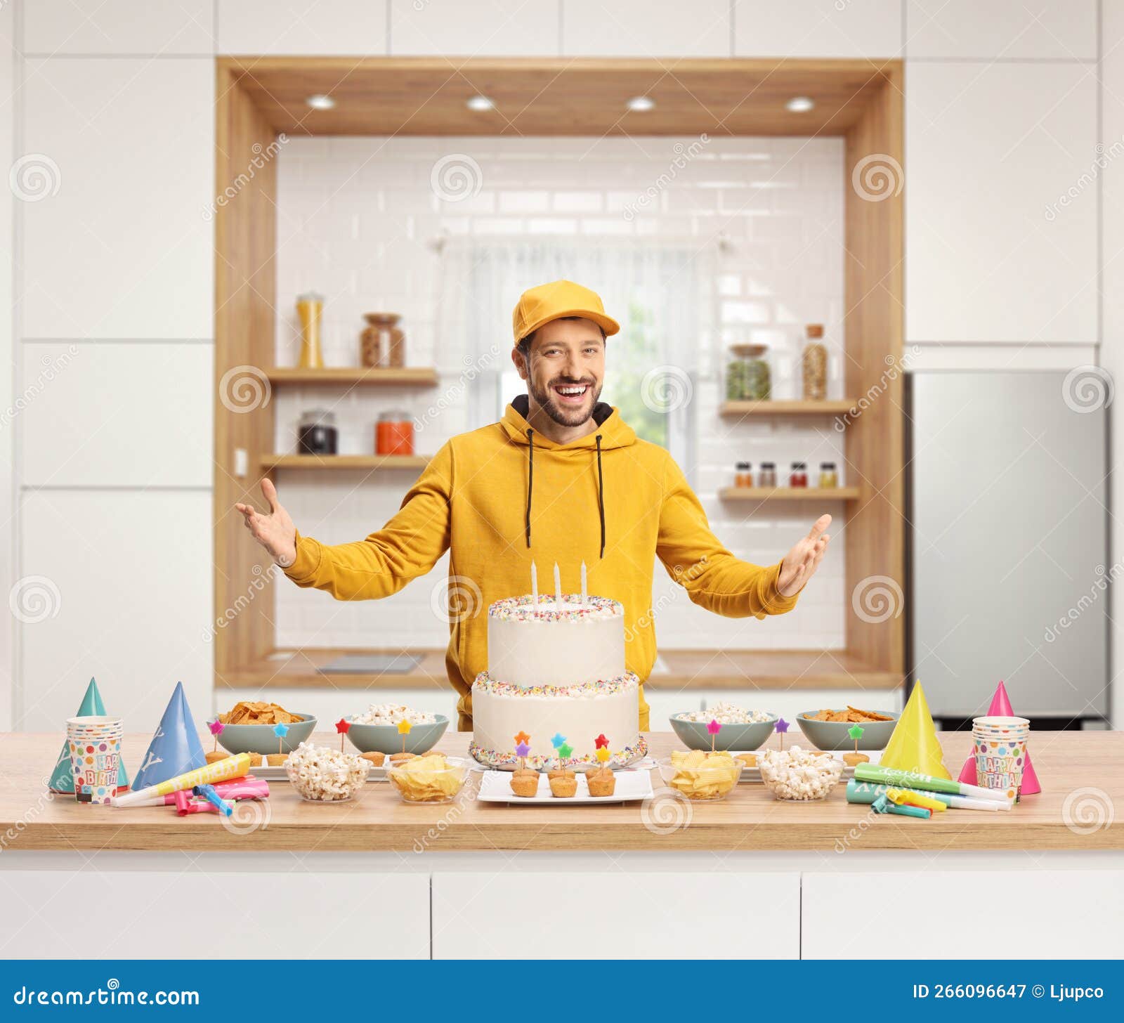 Guy in a Kitchen Standing Behind a Counter with Cake Stock Image ...