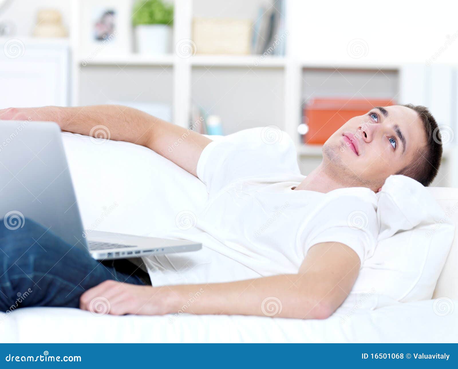 Guy with laptop looking up stock photo. Image of relax - 16501068