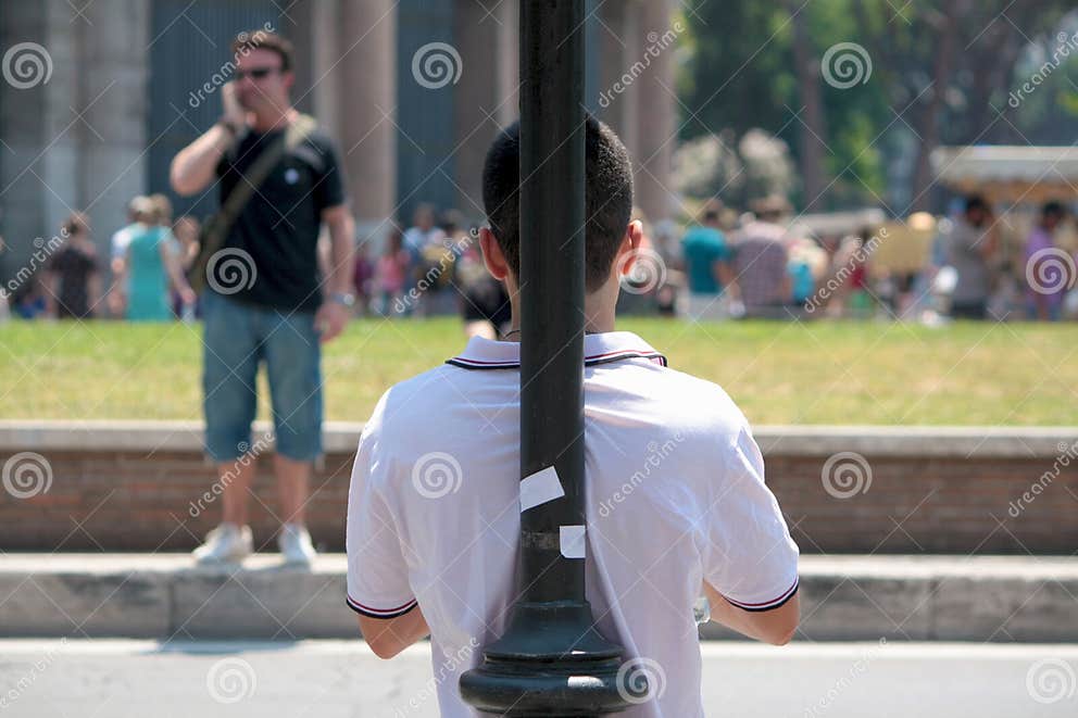 Guy Lean To Streetlamp, Man Talking Phone, Flock Around Colosseo ... Guy Lean To Streetlamp, Man Talking Phone, Flock Around Colosseo ...