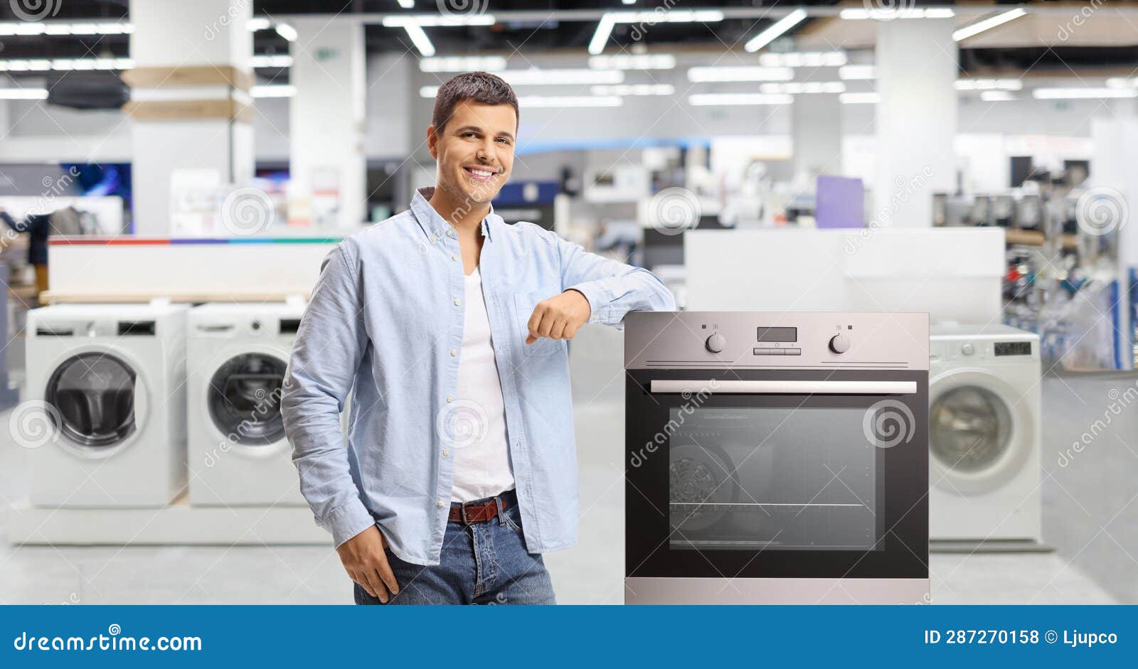 Guy Leaning on an Oven at a Home Appliances Shop Stock Photo - Image of ...