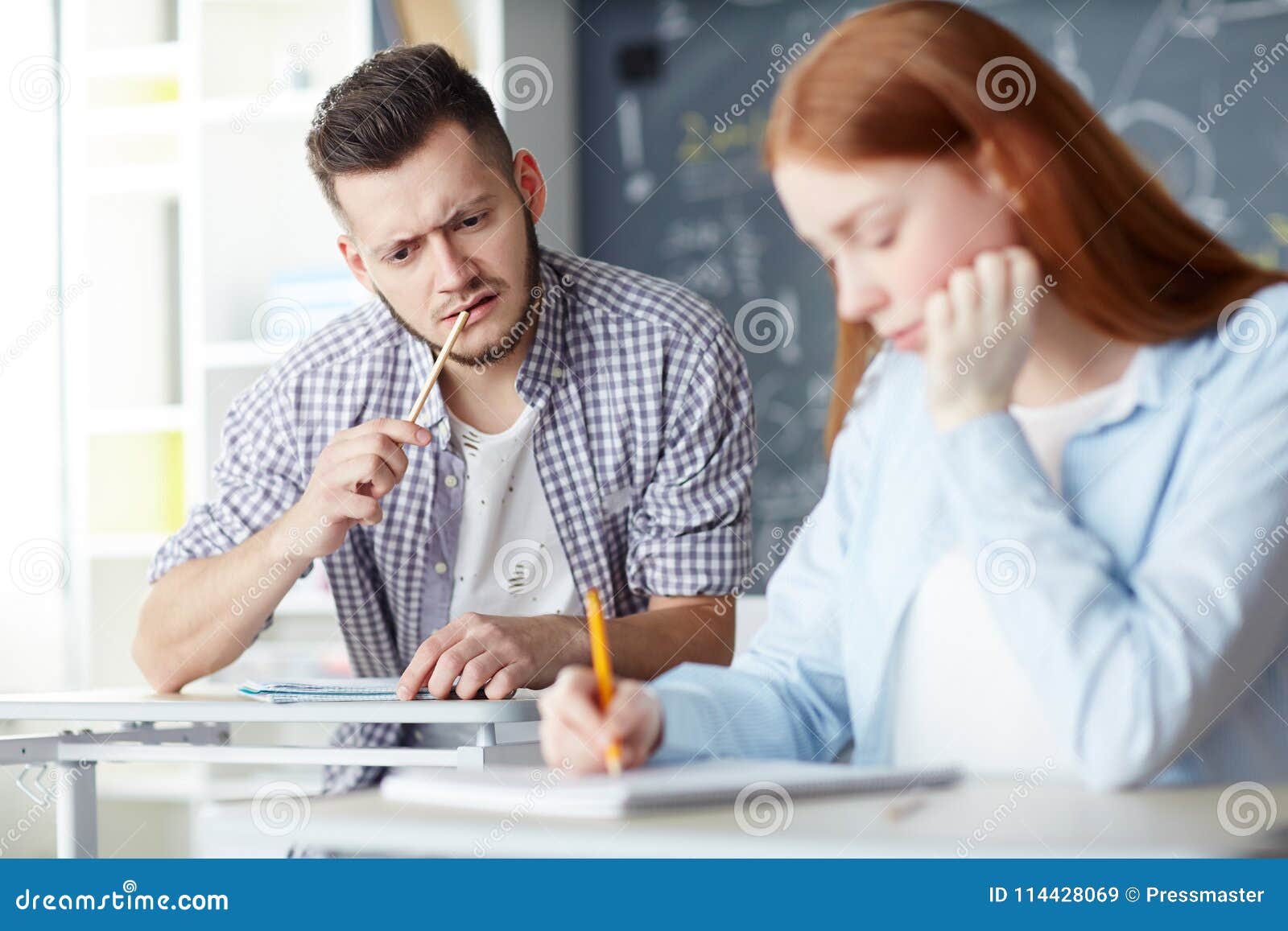 Reading notes of classmate stock image. Image of difficult - 114428069