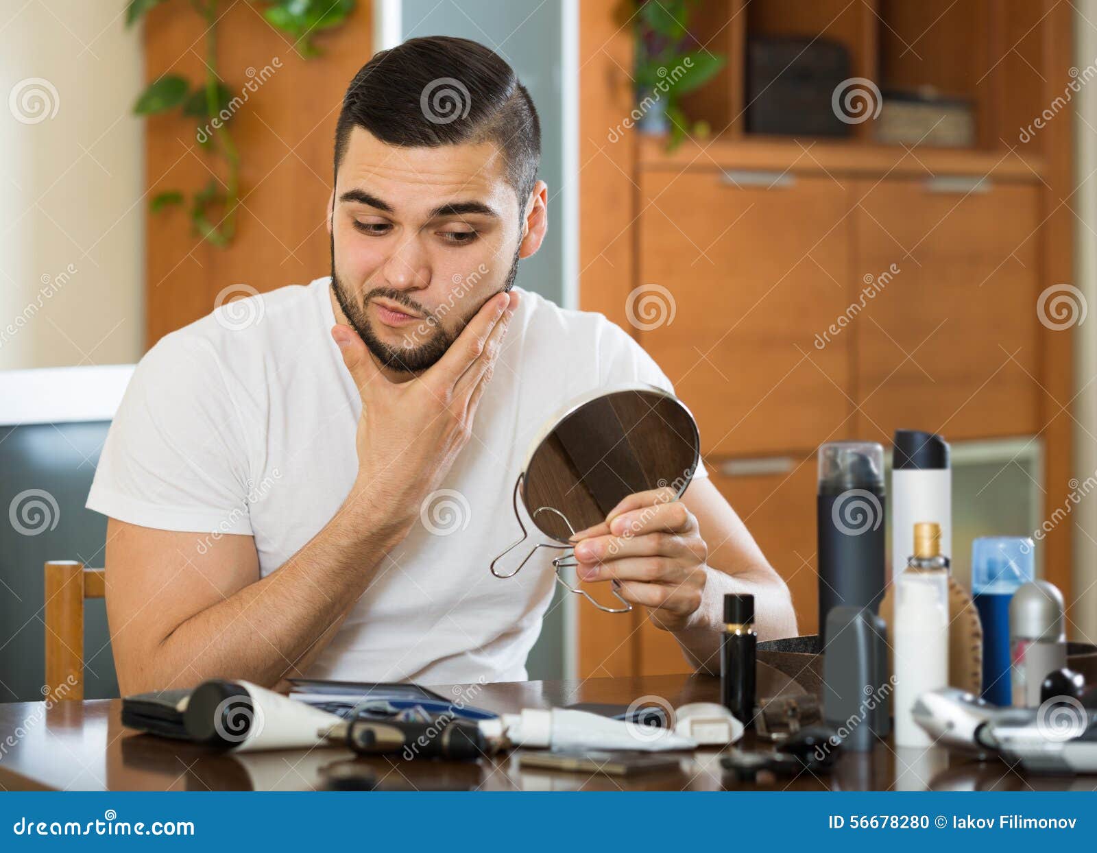 Guy Looking at His Problematic Skin in a Mirror Stock Photo - Image of ...