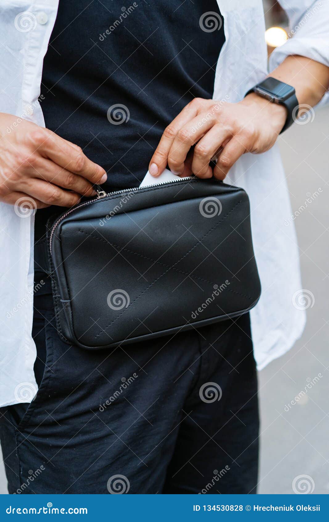 Guy Looking for Something in His Bag. Stock Photo - Image of male ...