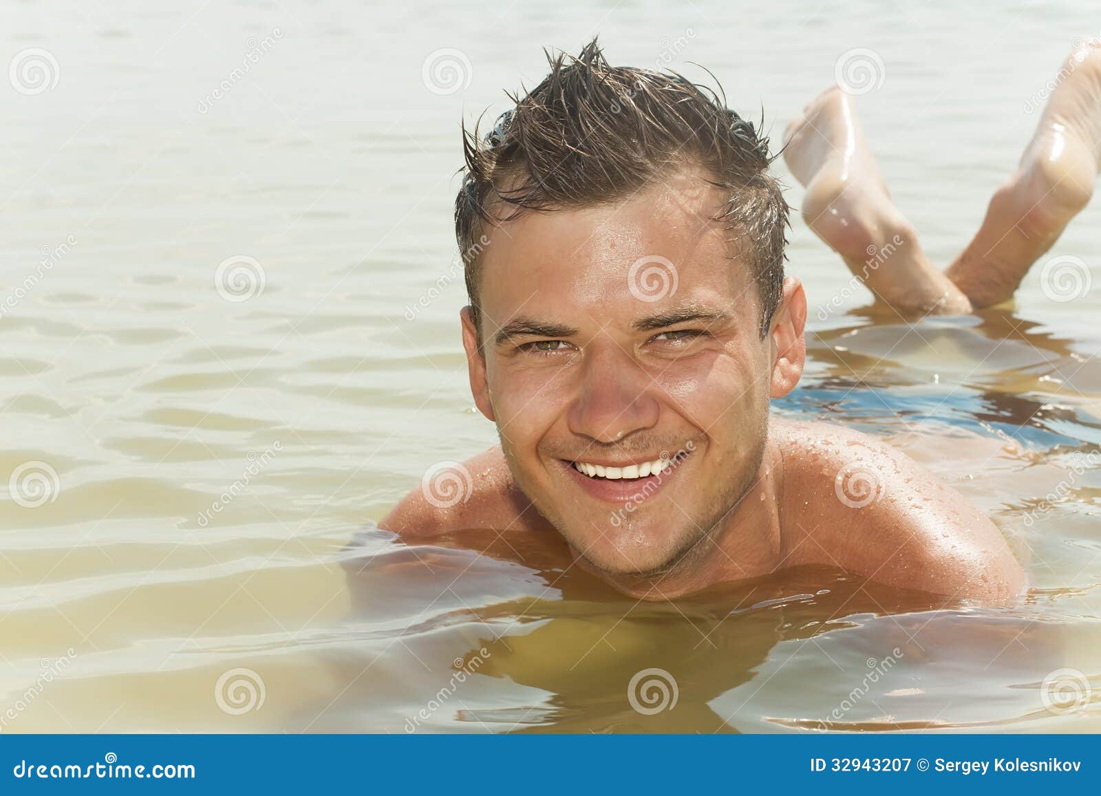 Guy lying in the water stock image. Image of beach, nature - 32943207