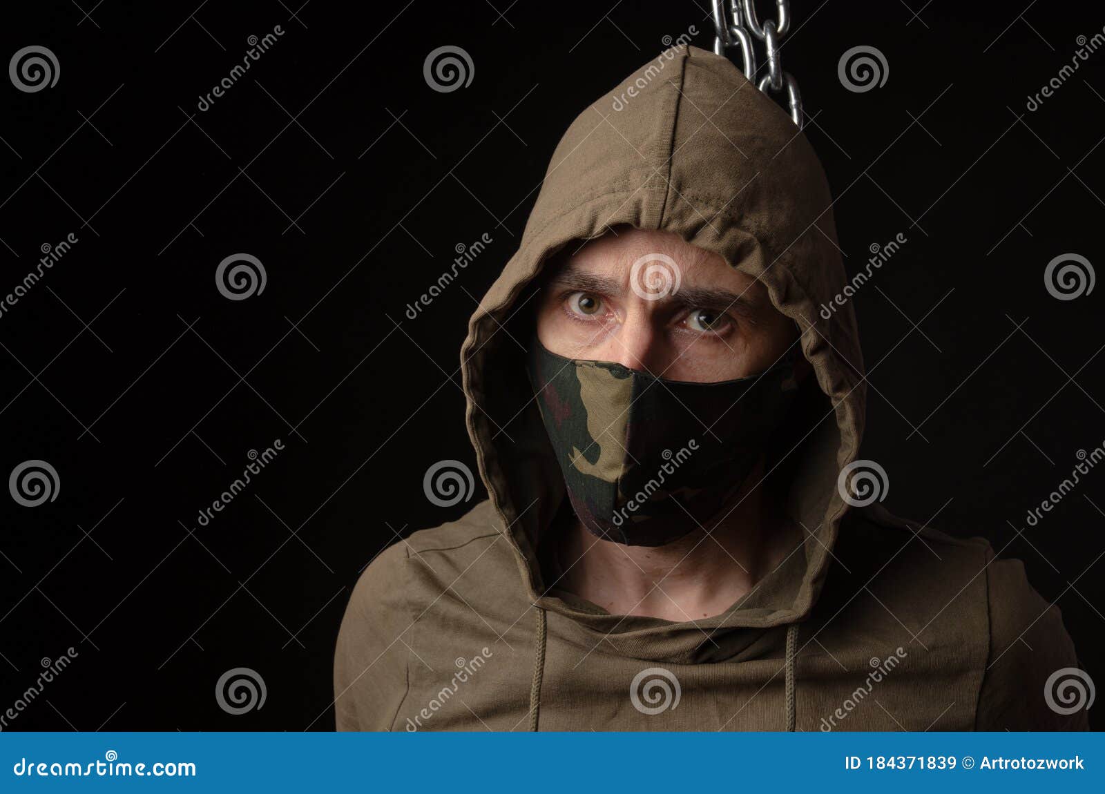 Guy in a Mask and Hood with Chains Stock Image - Image of pandemic ...
