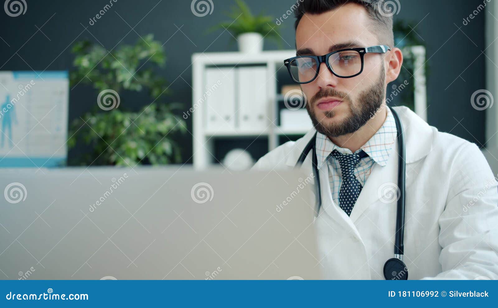 Guy Medic Using Laptop in Office Concentrated on Work with Computer in ...