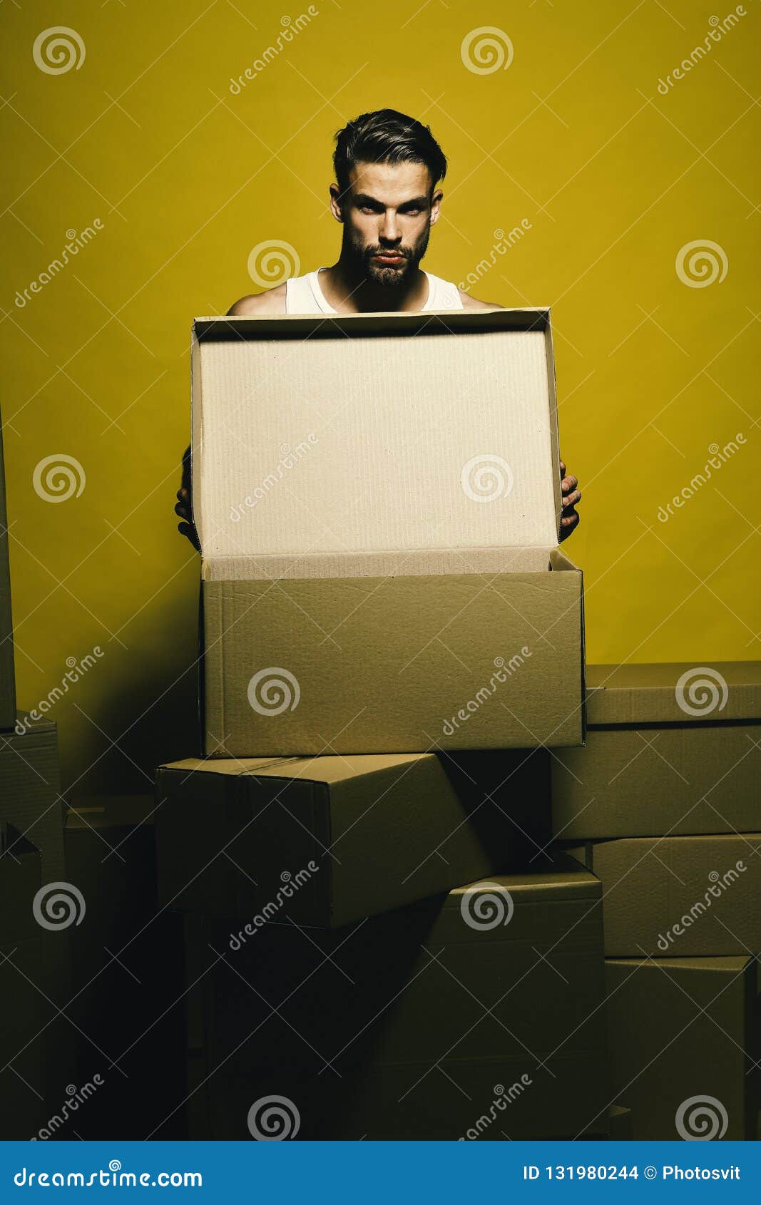 Sexuality And Building Concept. Guy With Muscular Torso Holds Box In ...