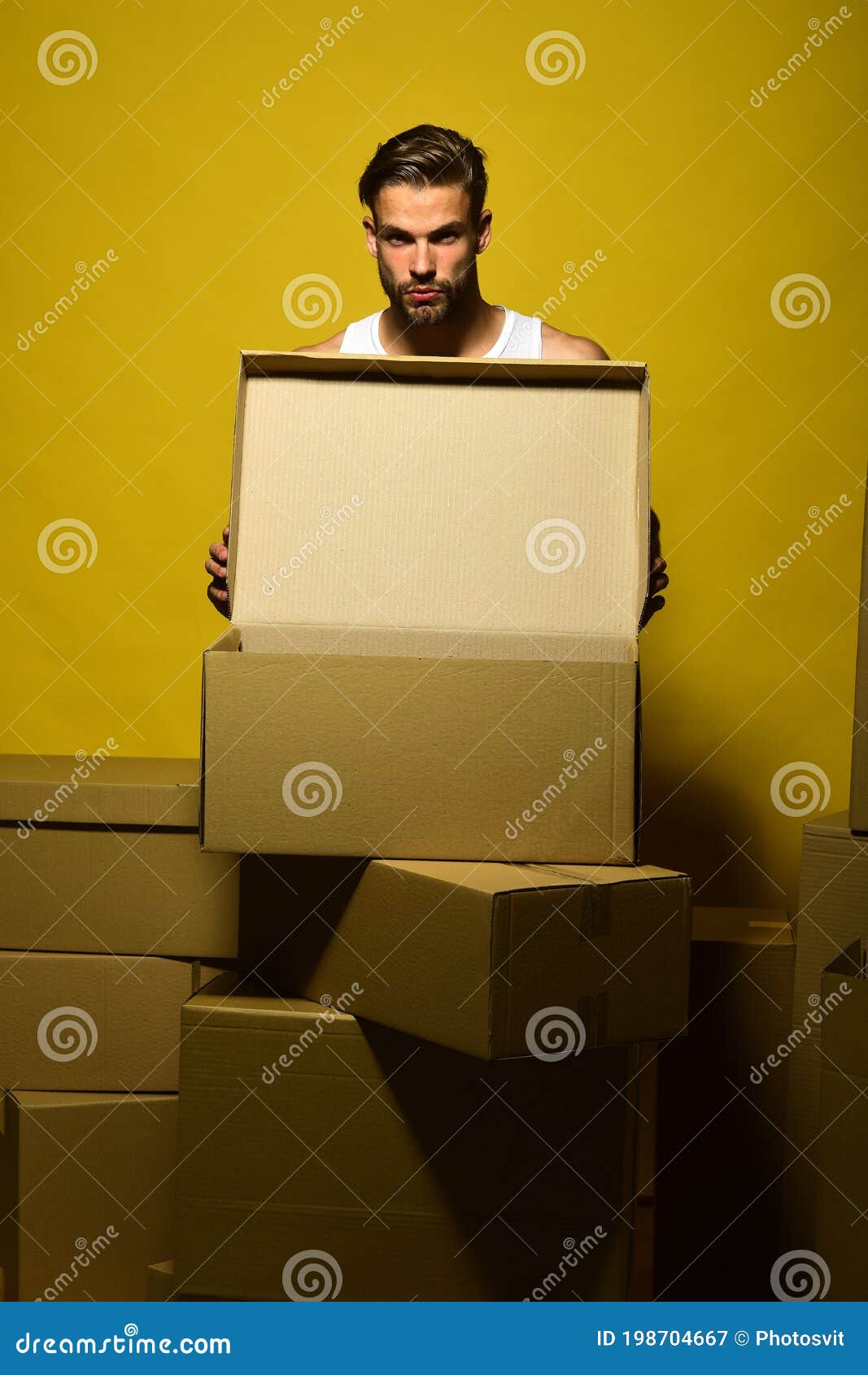 Sexuality And Building Concept. Guy With Muscular Torso Holds Box In ...