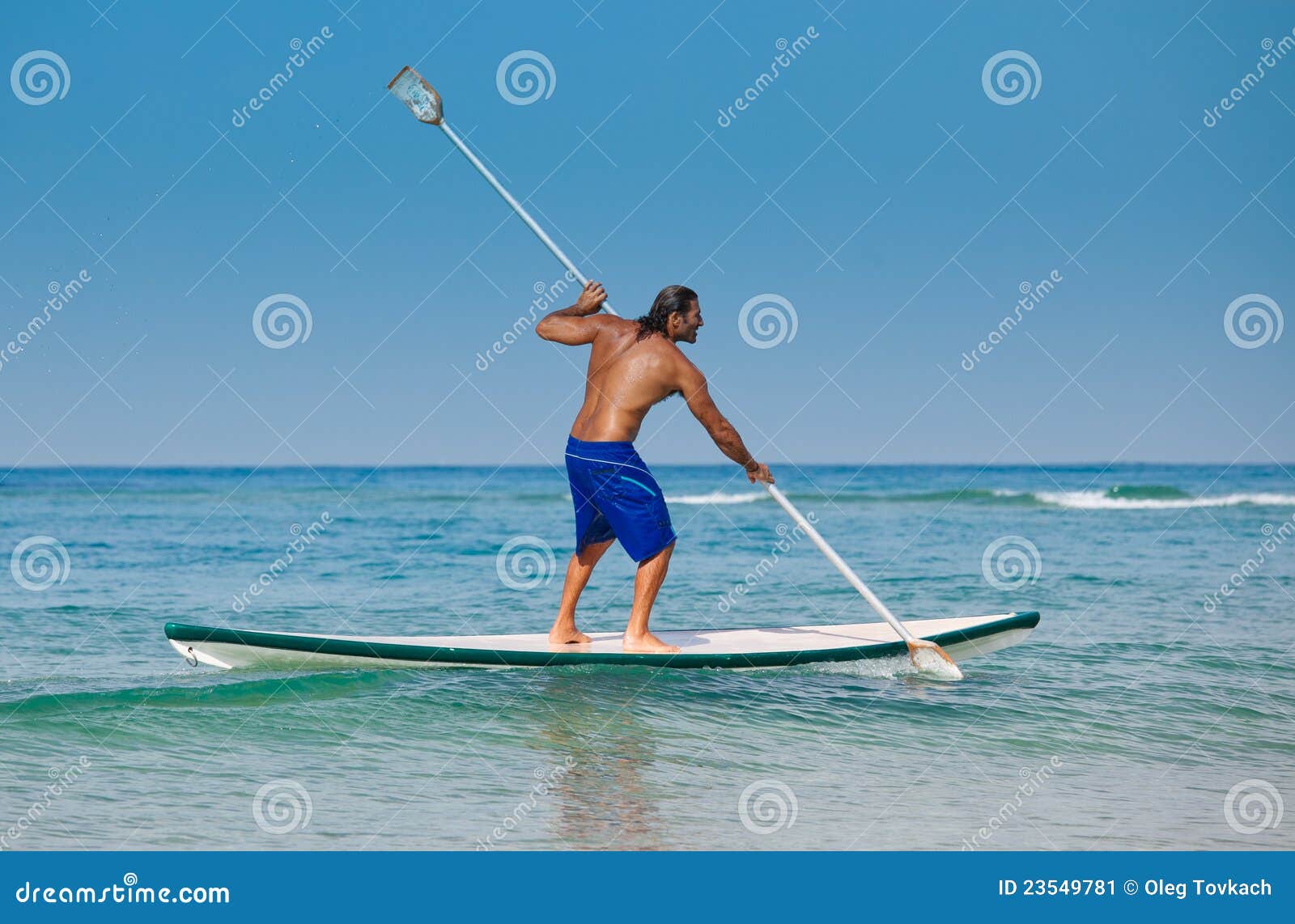 The Guy with an Oar on a Surfboard. Stock Image - Image of people ...