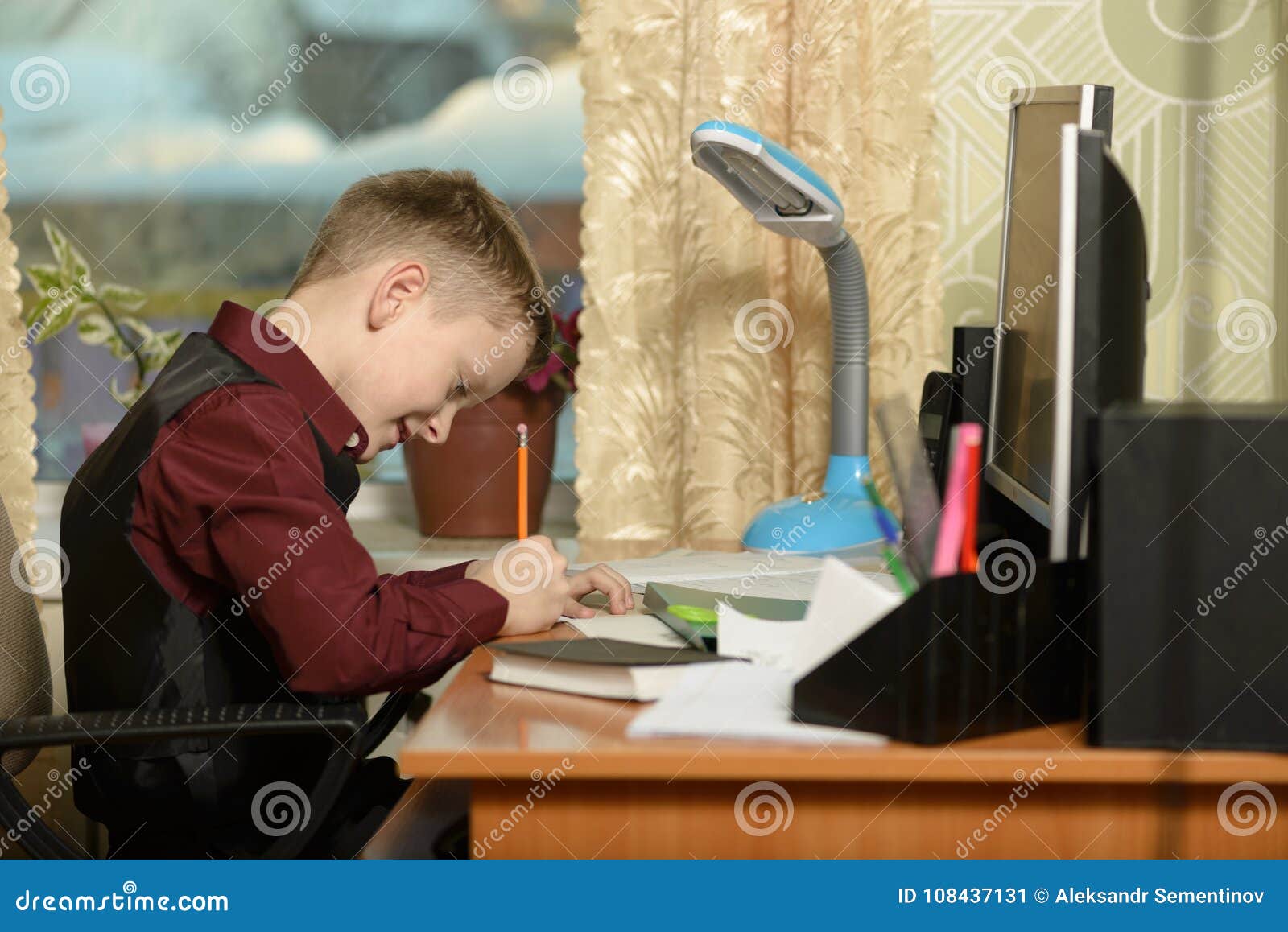 The Boy Works in His Office on a Personal Computer.he Writes Wit Stock ...