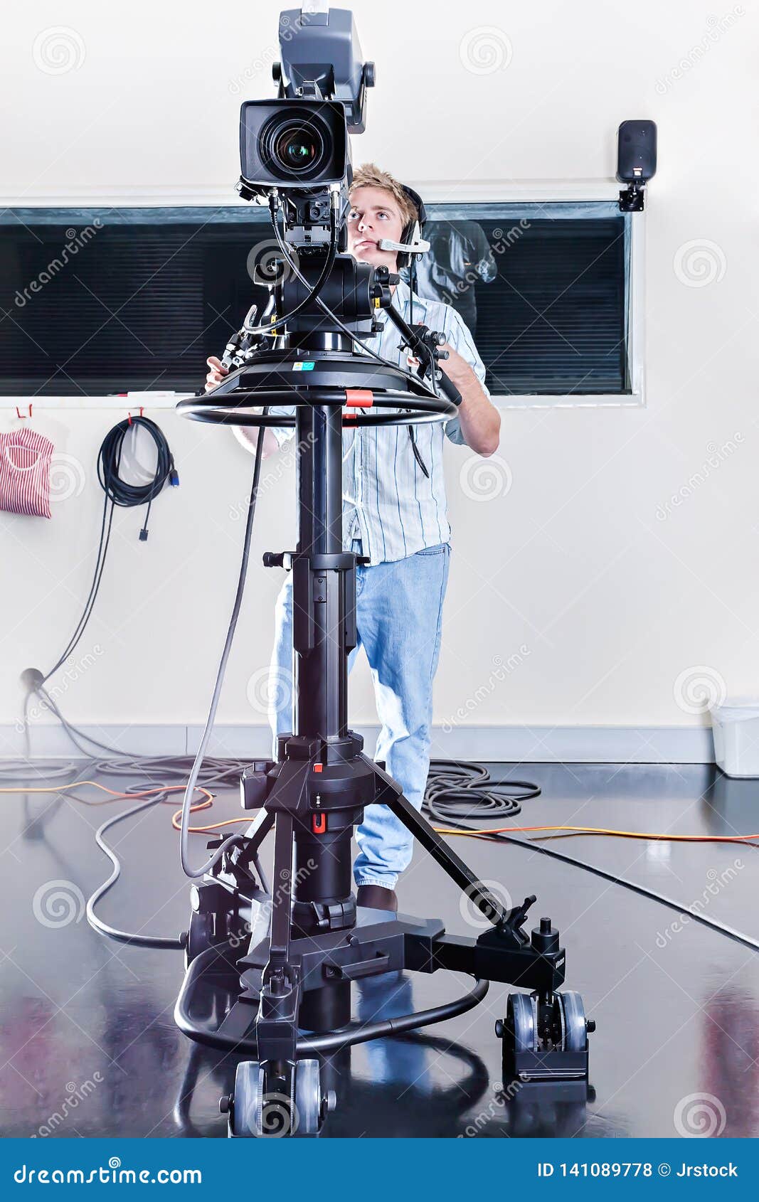 Guy is Operating a Huge Studio Camera in a Room Stock Photo - Image of ...