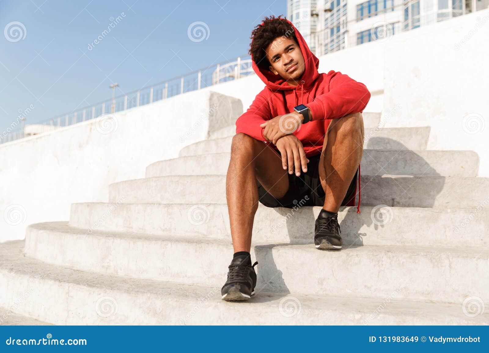 Guy Outdoors on the Beach Sitting on Steps Posing Stock Image - Image ...