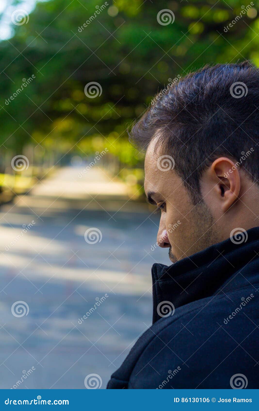 Guy in a park looking back stock photo. Image of herbal - 86130106