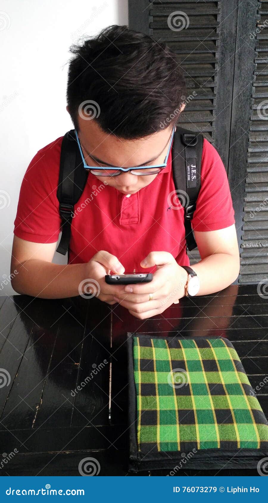 A Guy Playing Handphone editorial stock image. Image of buyer - 76073279