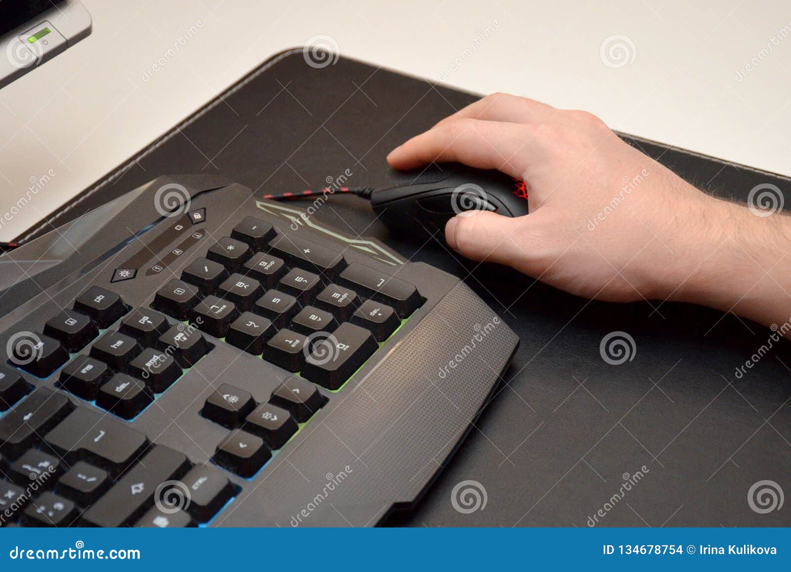 Guy is Playing a Video Game. Close Up of a Hand Lying on a Mouse and a ...