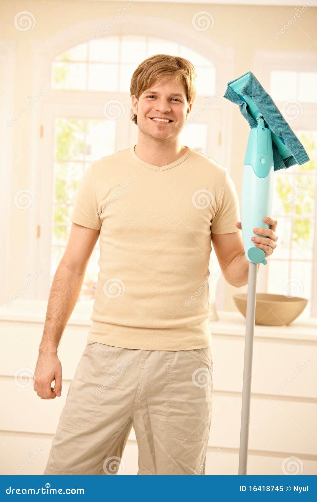 Guy posing with mop stock image. Image of contact, blue - 16418745