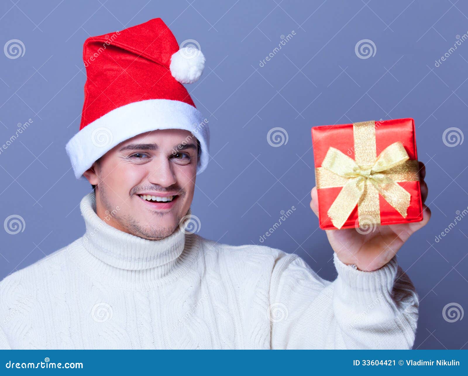 Guy with present stock image. Image of studio, male, smile - 33604421