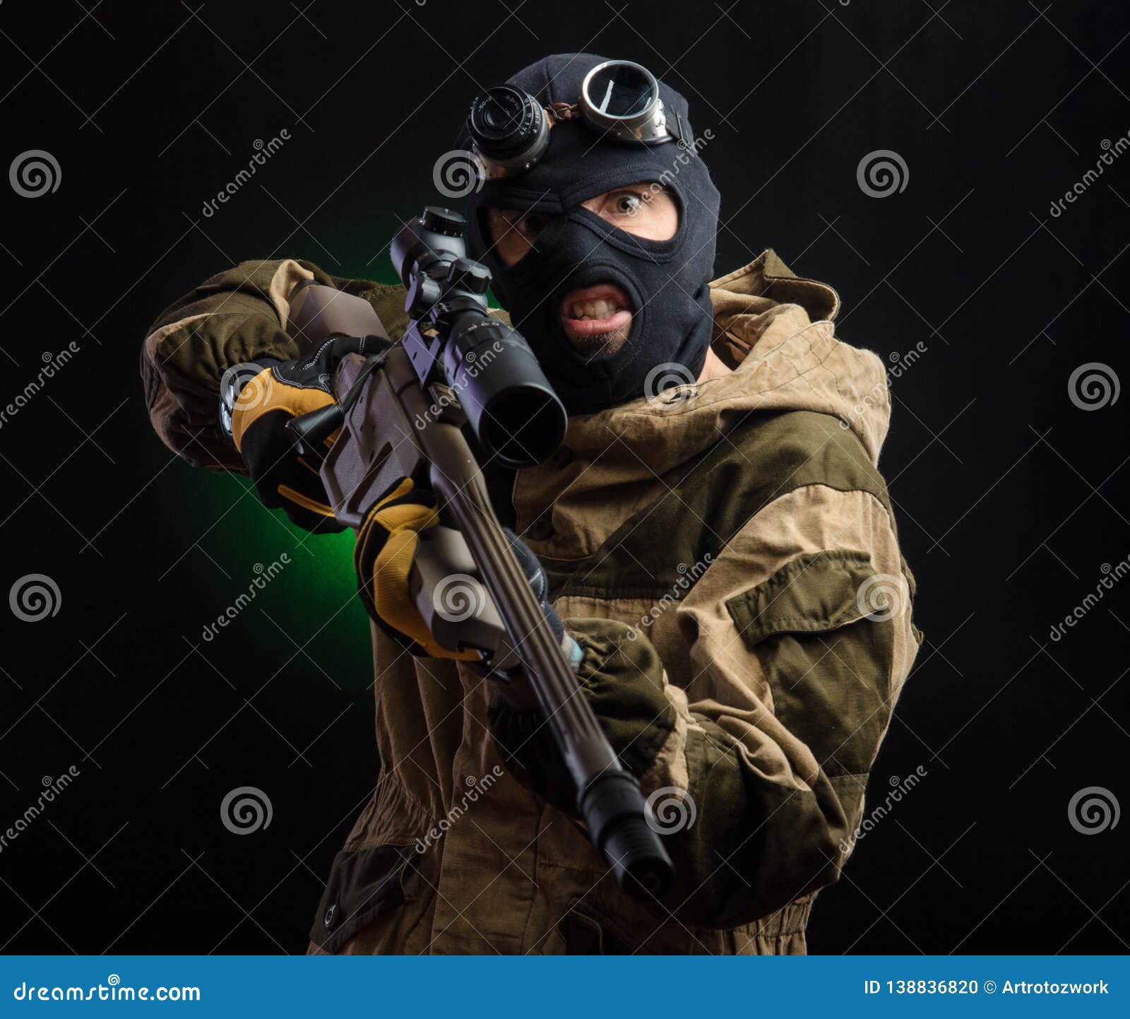 The Guy in Protective Clothing and a Black Mask with a Sniper Rifle ...