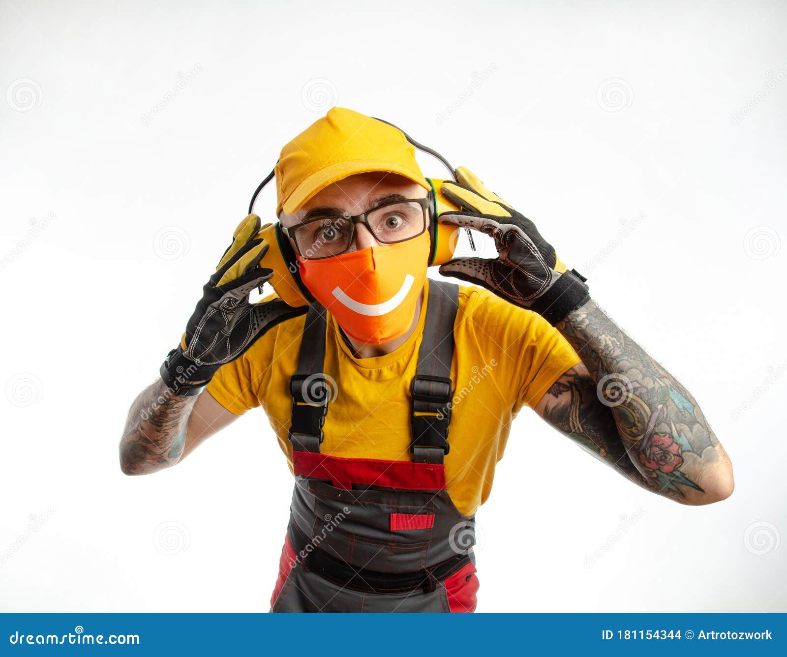 A Guy in Protective Coveralls with a Chainsaw on a White Background ...