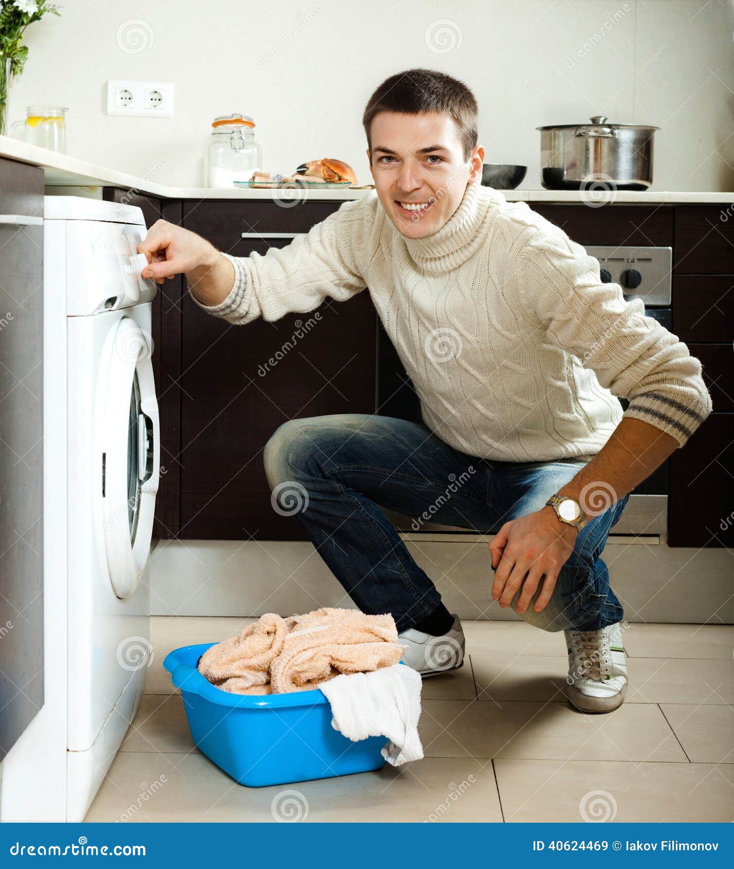 Guy Putting Clothes into Washing Machine Stock Image - Image of ...