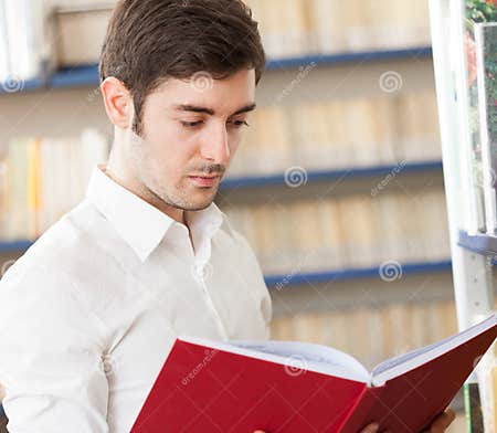 Guy reading a book stock image. Image of library, studying - 30128805