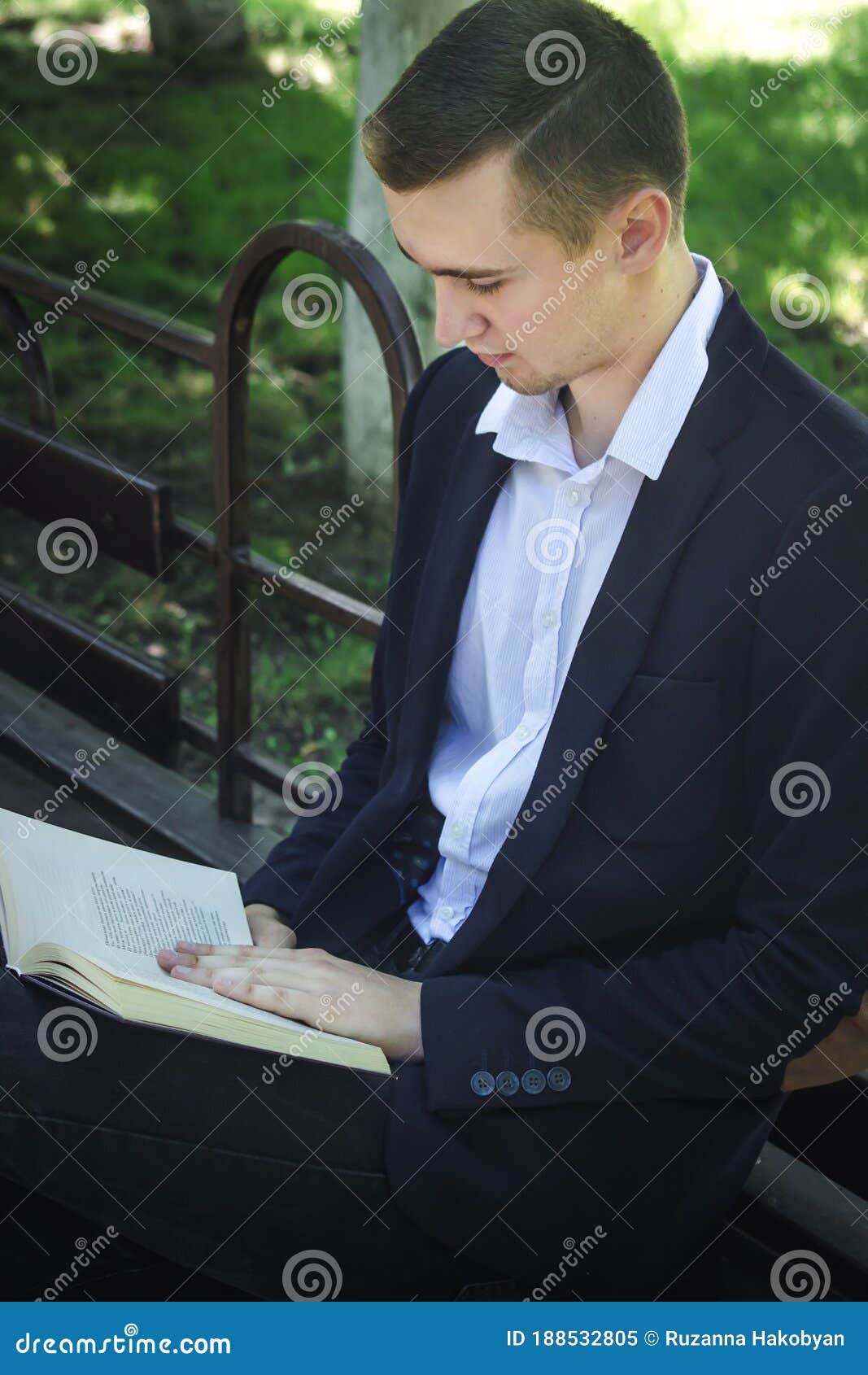The guy is reading a book. stock image. Image of reading - 188532805