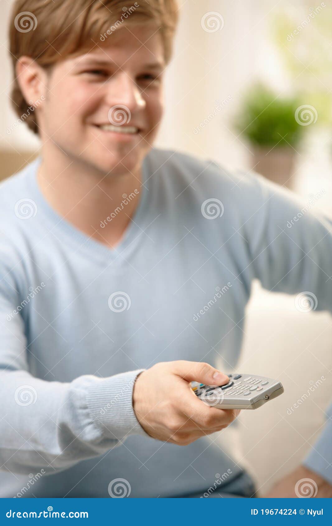Guy with remote control stock photo. Image of face, european - 19674224