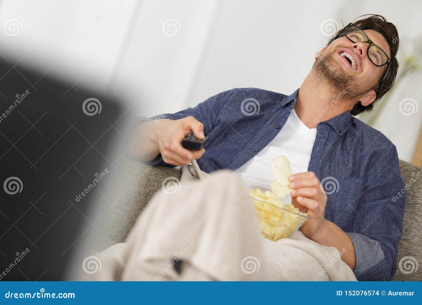 Guy with Remote Control Laughingat Television Stock Photo - Image of ...