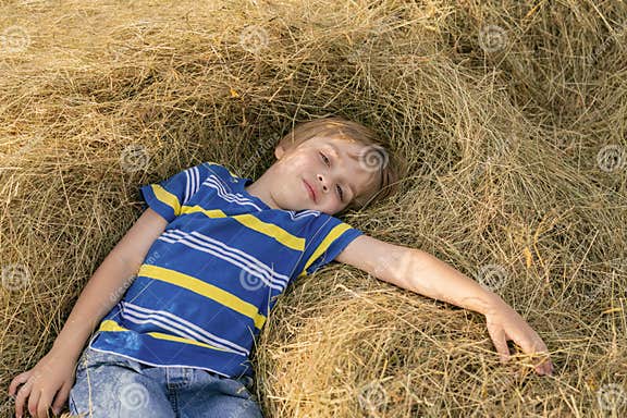The Guy is Resting, Lying on the Hay Stock Image - Image of outdoors ...