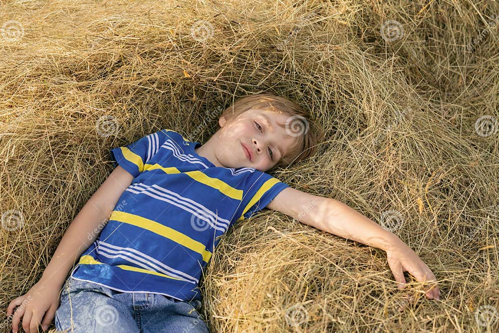 The Guy is Resting, Lying on the Hay Stock Image - Image of outdoors ...