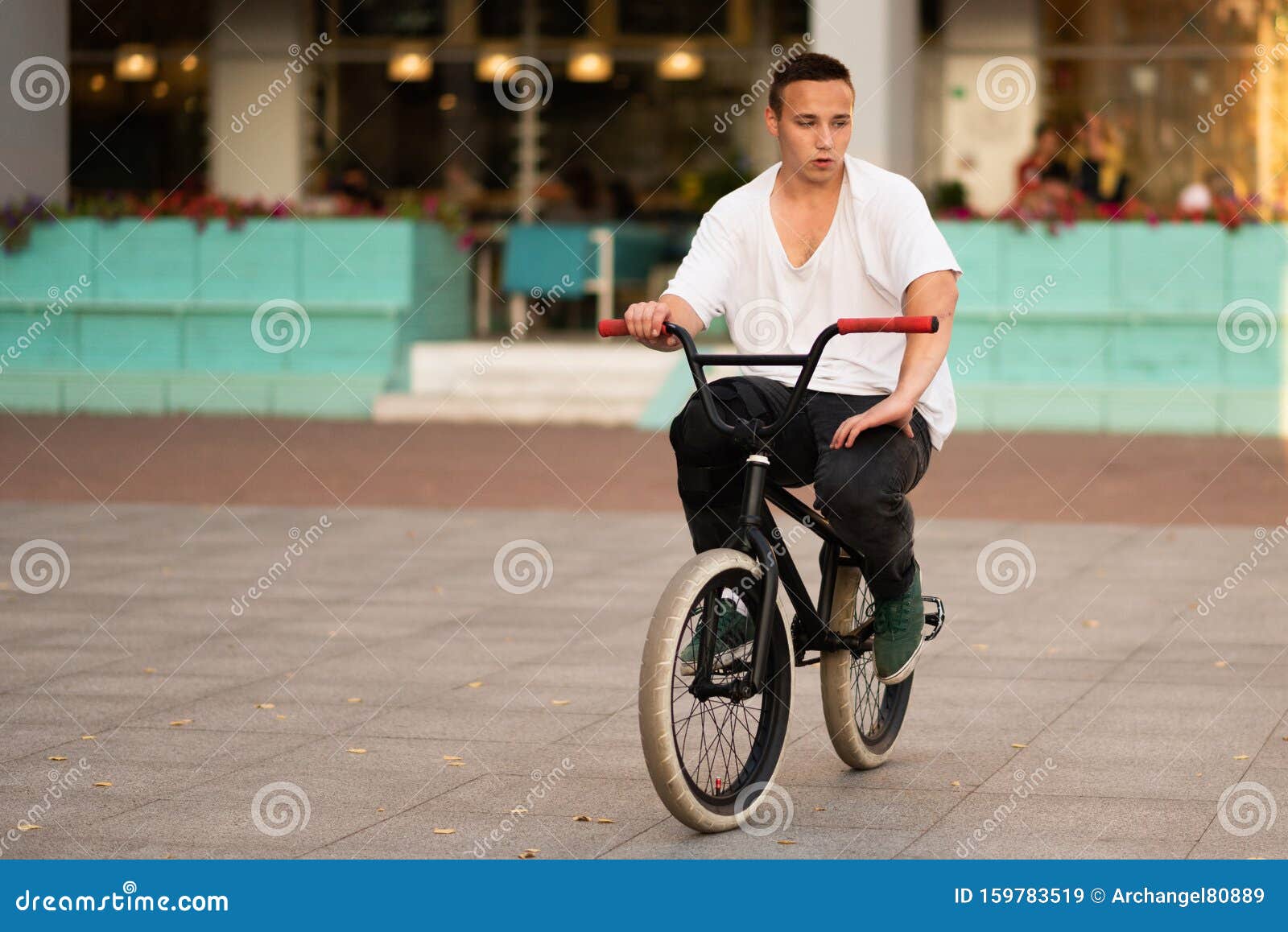 The Guy Rides on the BMX, Sitting on the Seat Stock Image - Image of ...