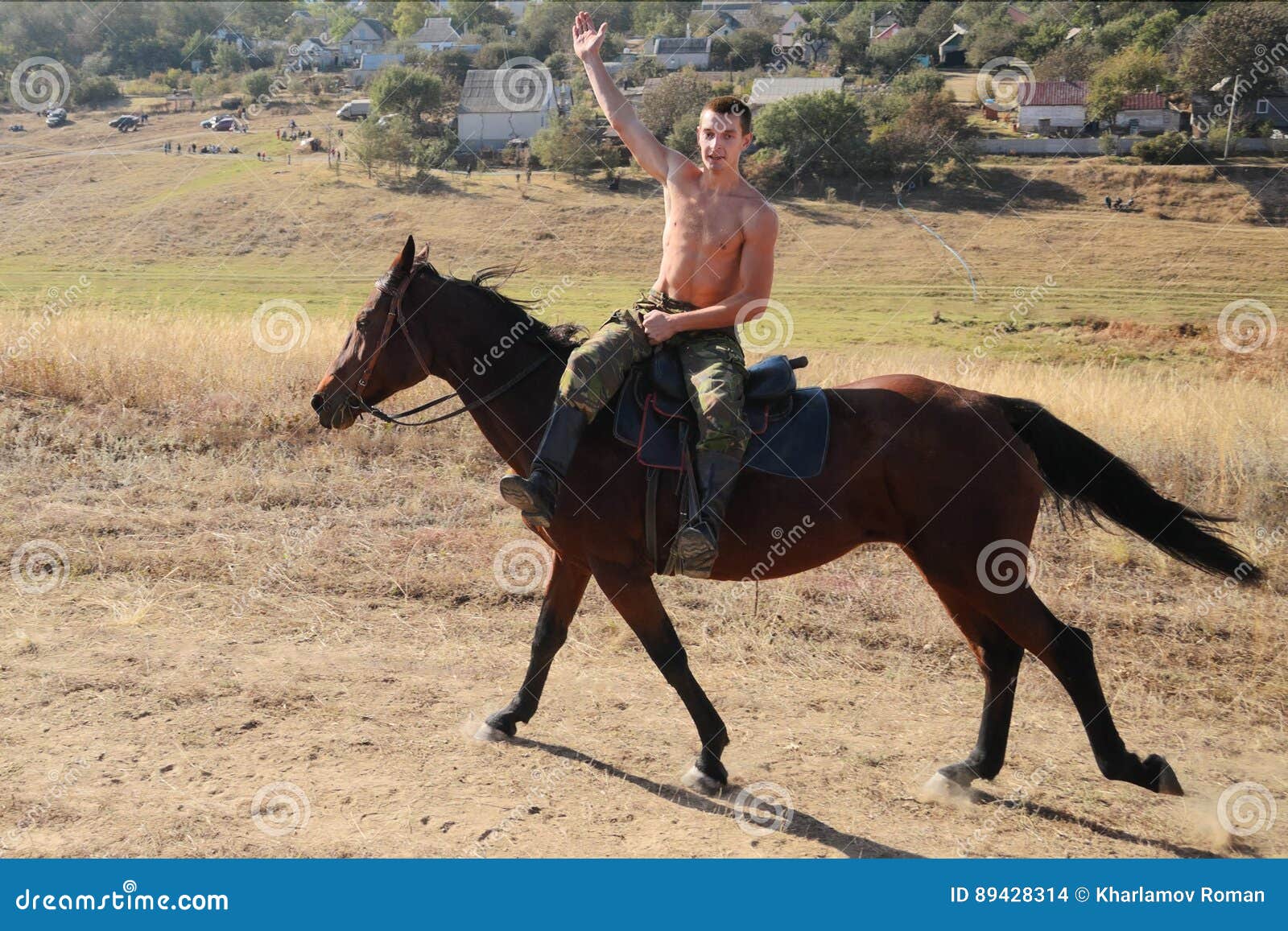 The guy is riding a horse3 stock photo. Image of jumps - 89428314