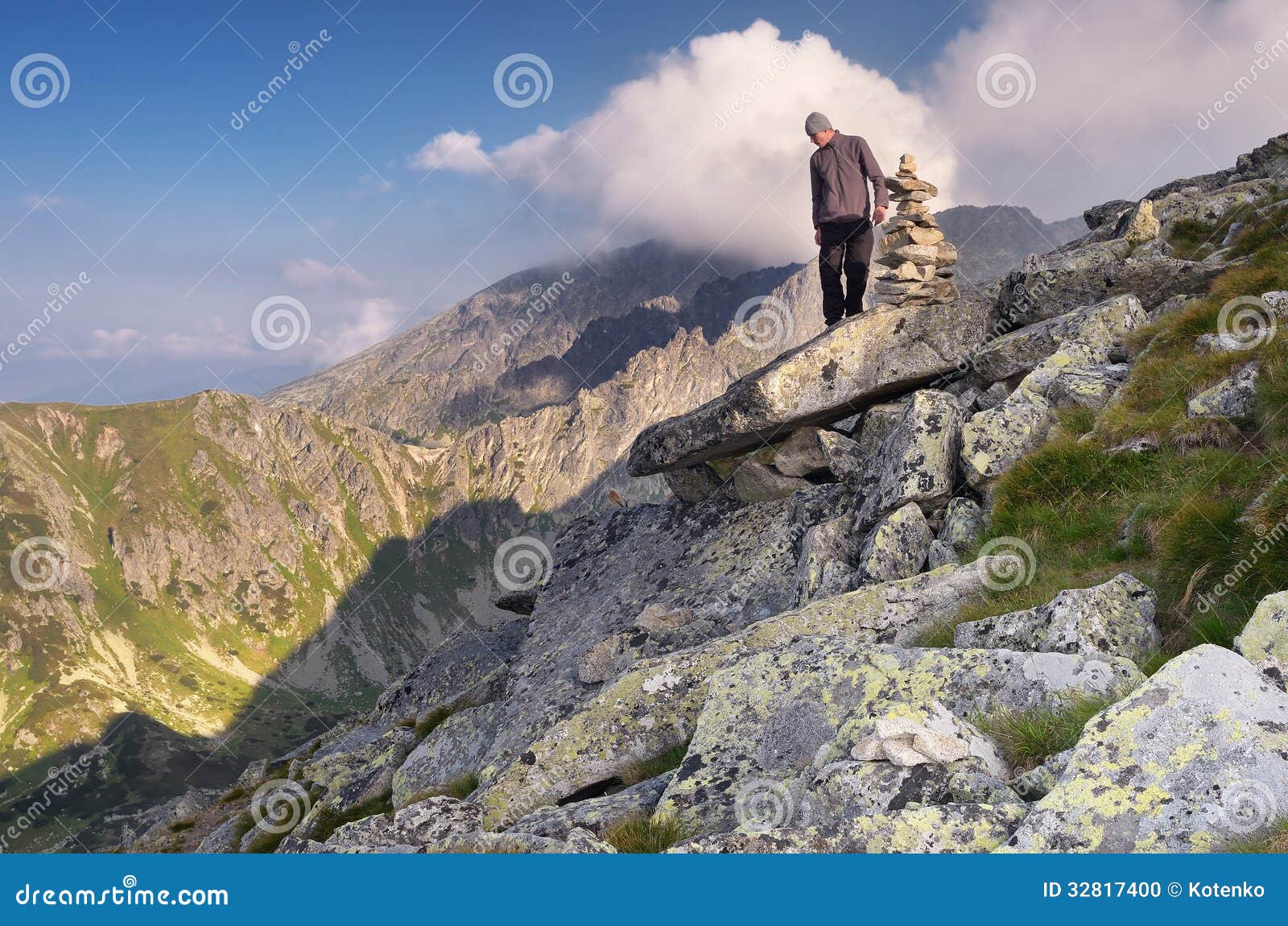 Guy on the rock stock photo. Image of background, people - 32817400