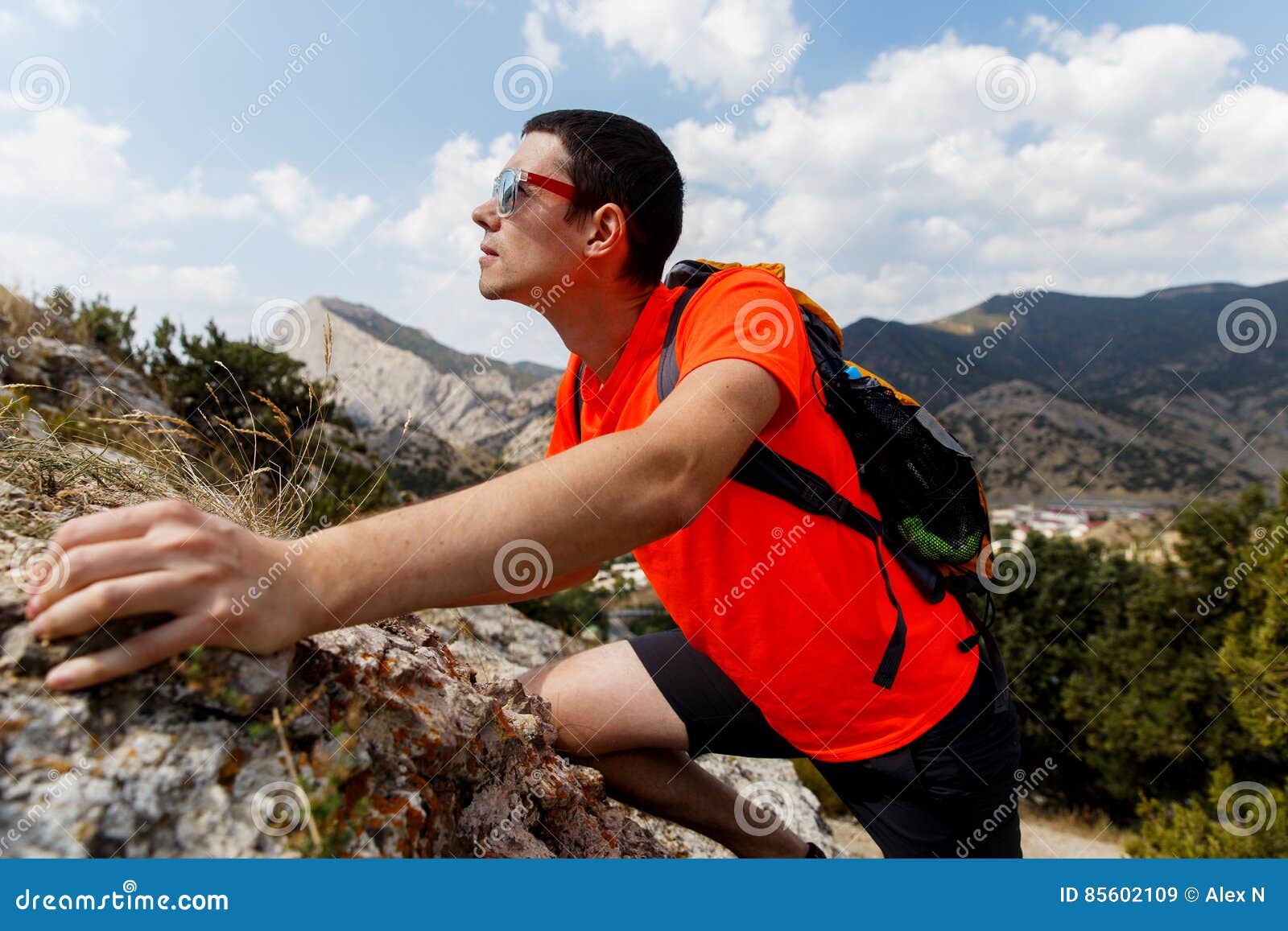 Guy on rock in mountains stock image. Image of courage - 85602109