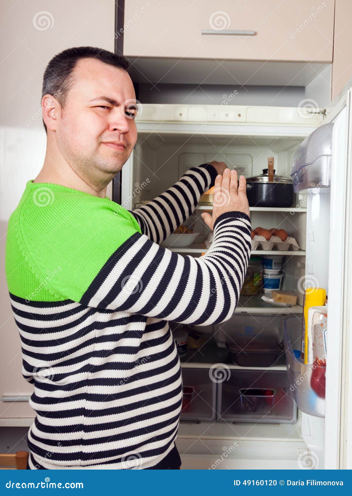 Guy Searching for Something in Refrigerator Stock Photo - Image of ...