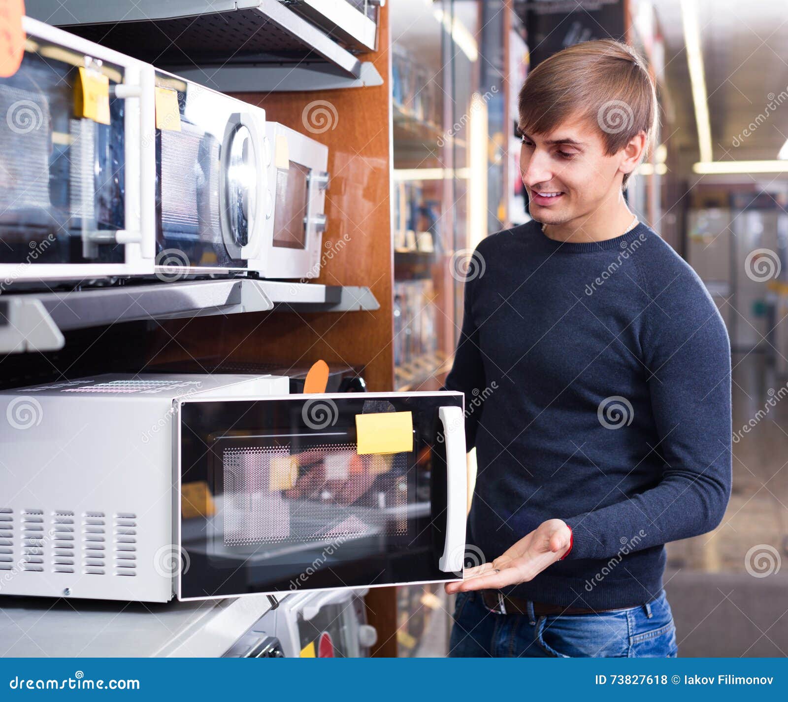 Guy Selecting Microwave Oven Stock Photo - Image of looking, kitchen ...