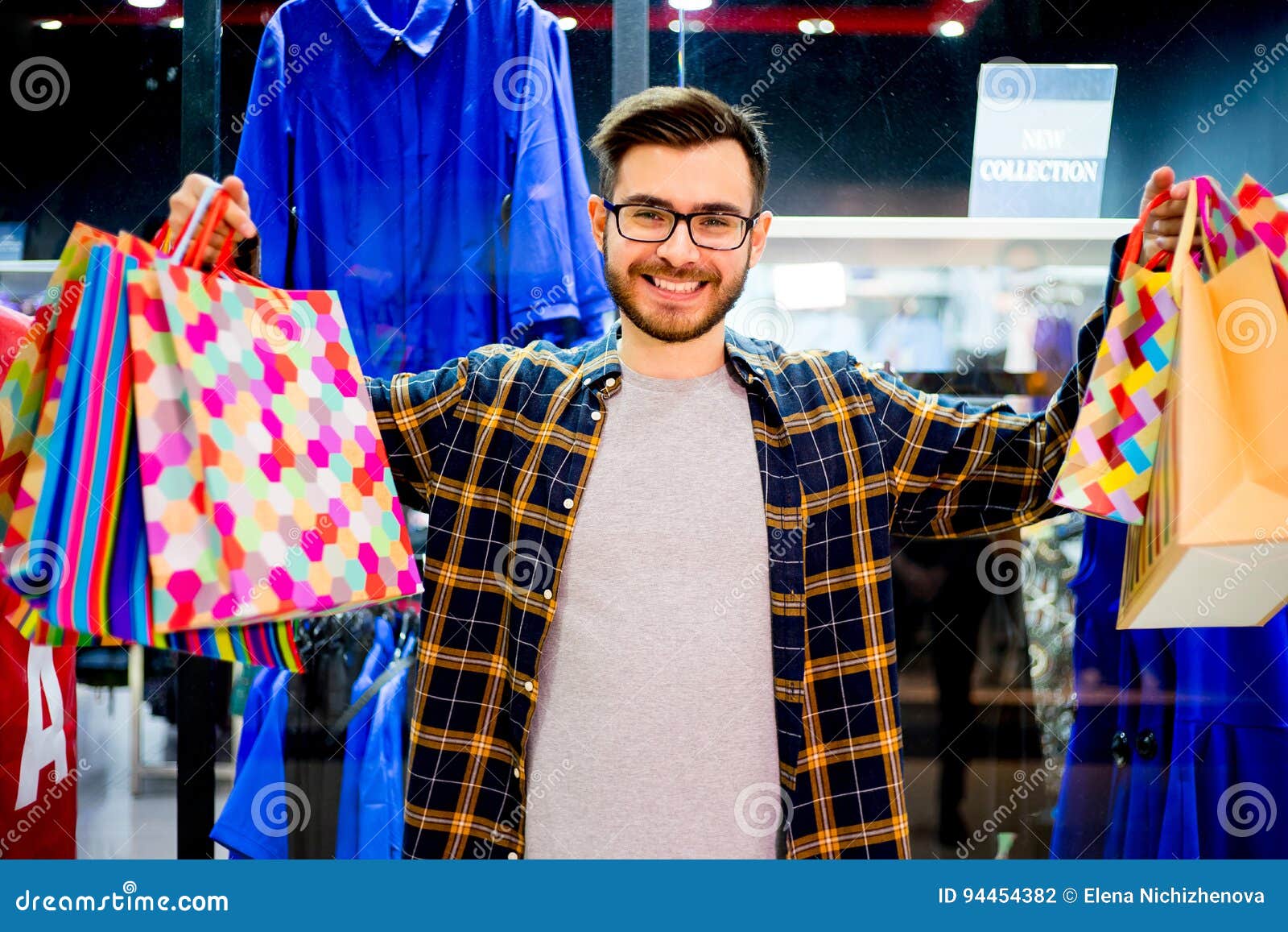 Guy shopping in a mall stock photo. Image of casual, cheerful - 94454382